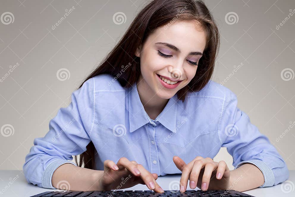 Gorgeous Smiling Woman Using Keypad Stock Photo - Image of girl, gray ...