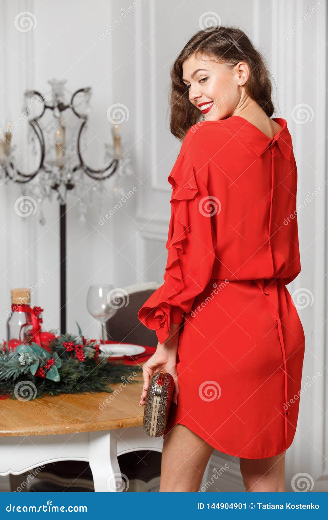 Gorgeous Stylish Girl Dressed in the Fashionable Red Dress Poses in the ... Gorgeous Stylish Girl Dressed in the Fashionable Red Dress Poses in the ...