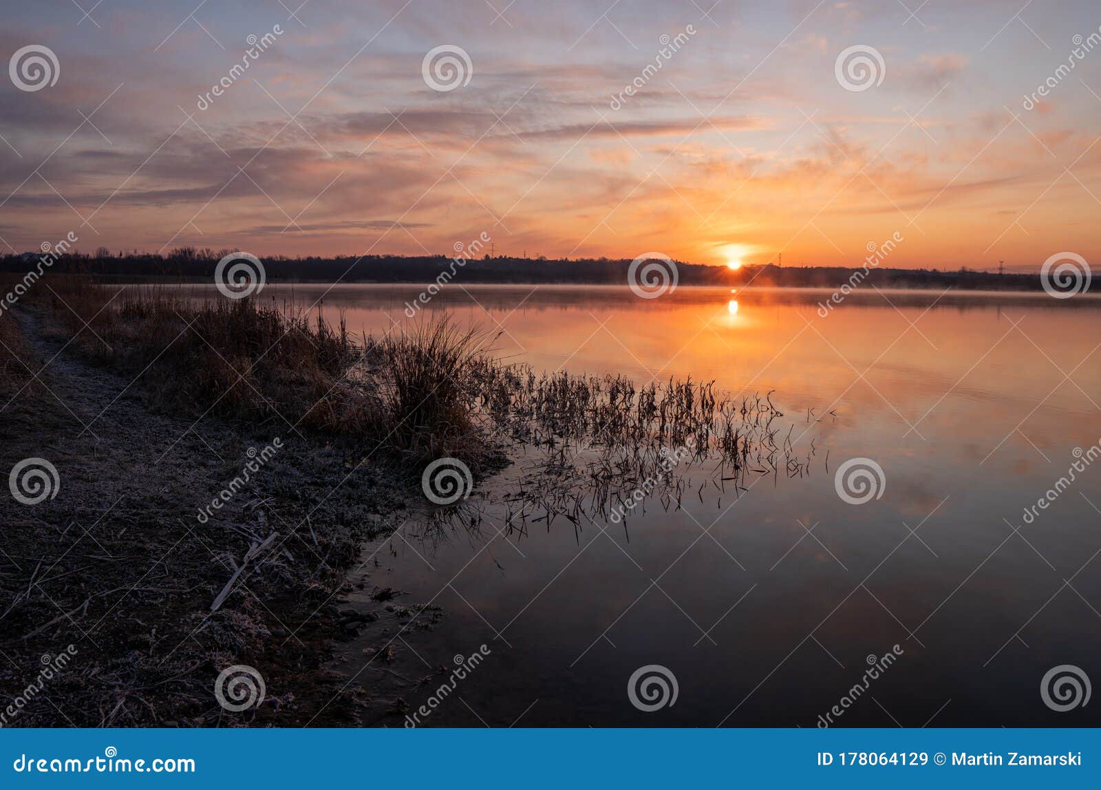 Gorgeous Sunrise Over the Lake with Reflection of the Sun on the Lake ...