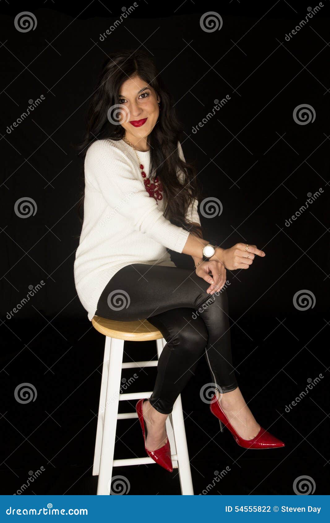 Gorgeous Tan Woman Posing on a Bar Stool Stock Photo - Image of hair ...