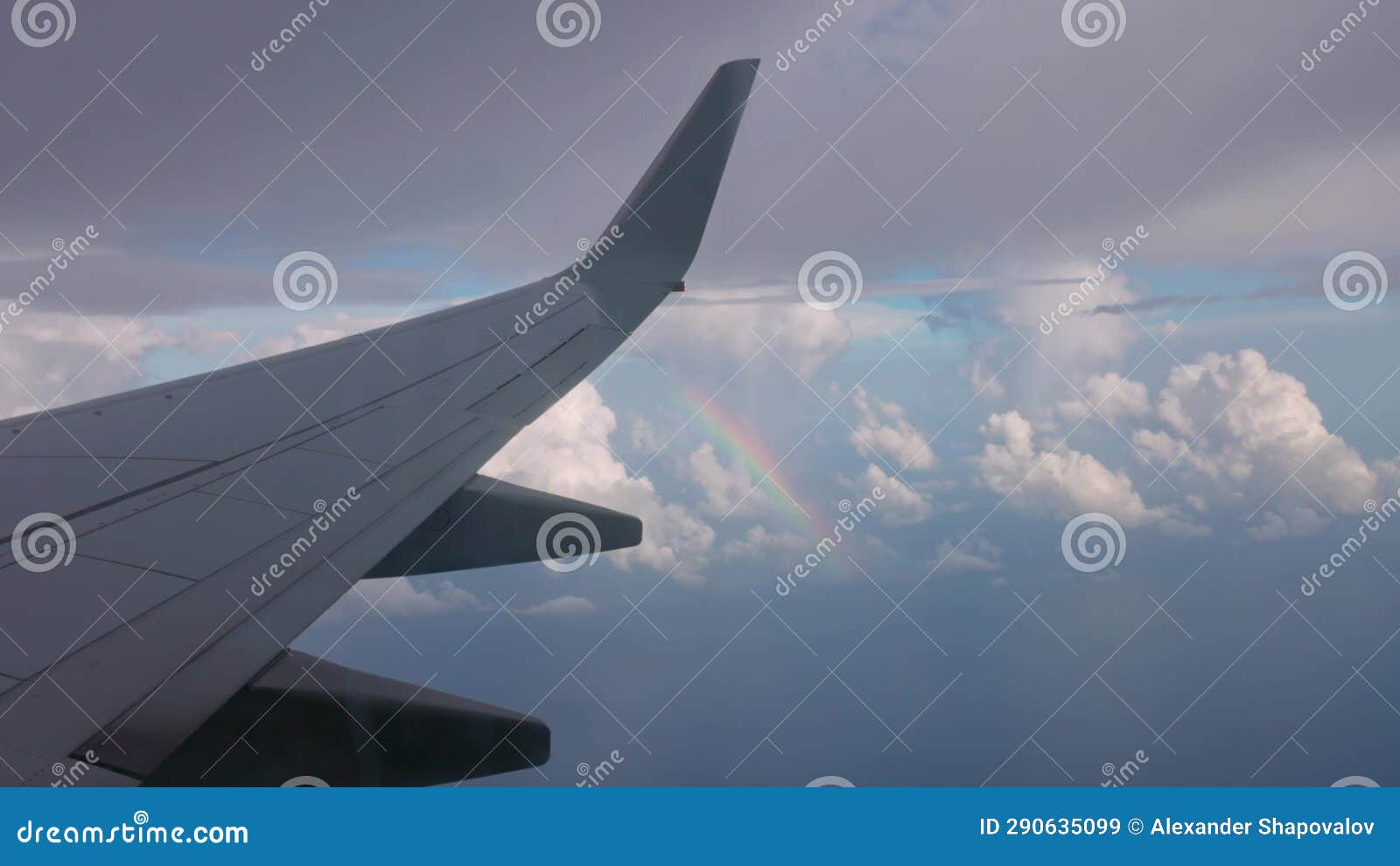 Gorgeous View at Aircraft Wing and Rainbow between White Clouds during ...