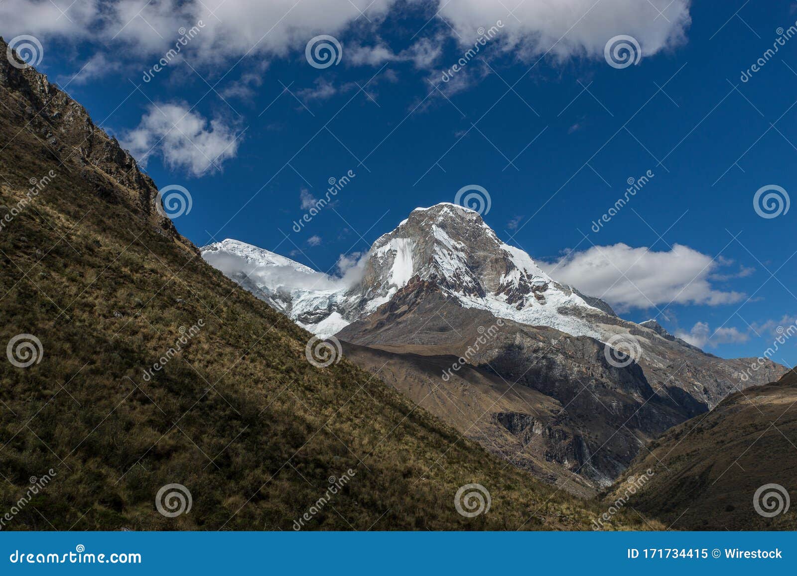 Gorgeous View of a Summit Under a Blue and Cloudy Sky in Peru Stock ...