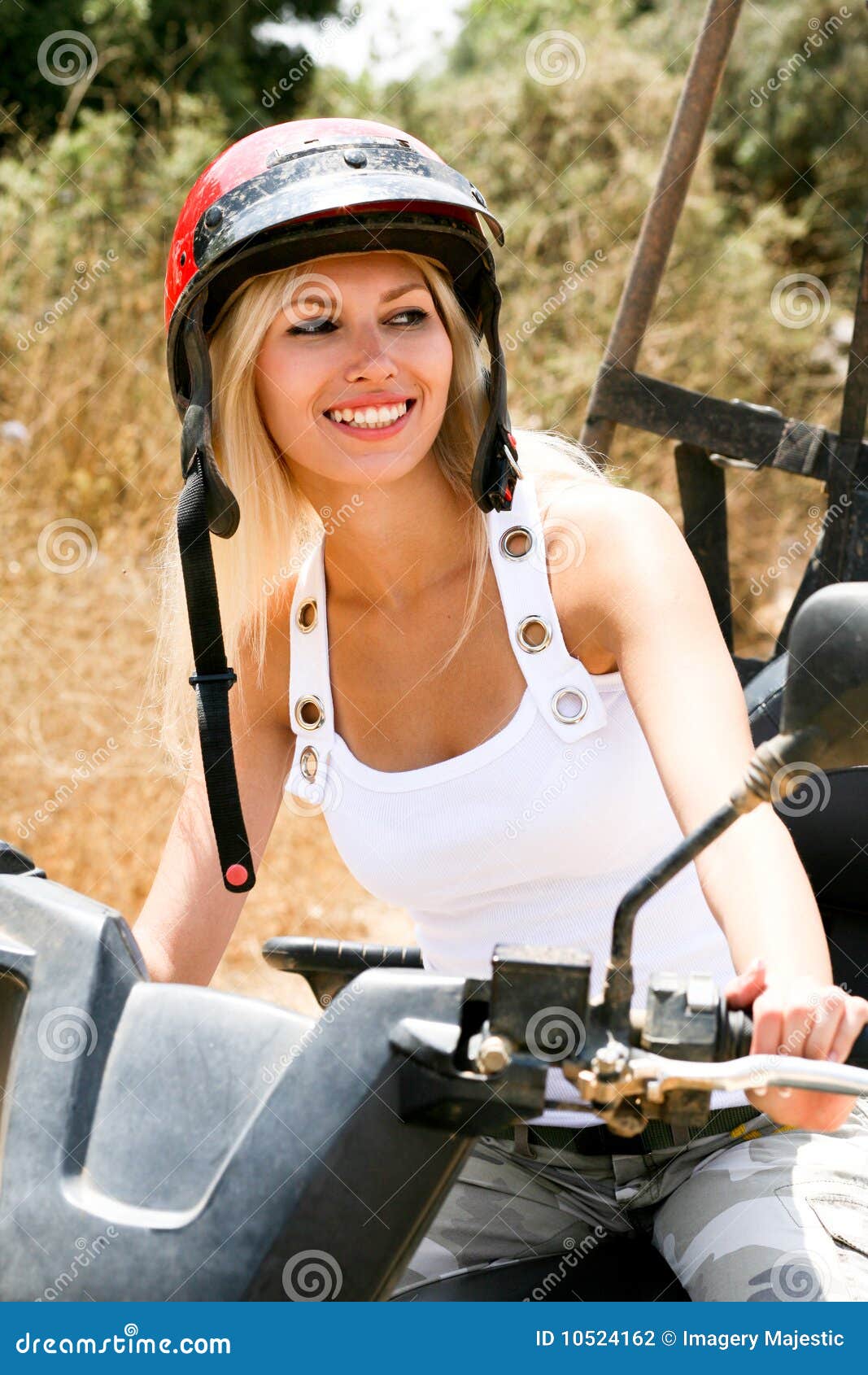 Gorgeous woman on the atv stock photo. Image of looking - 10524162