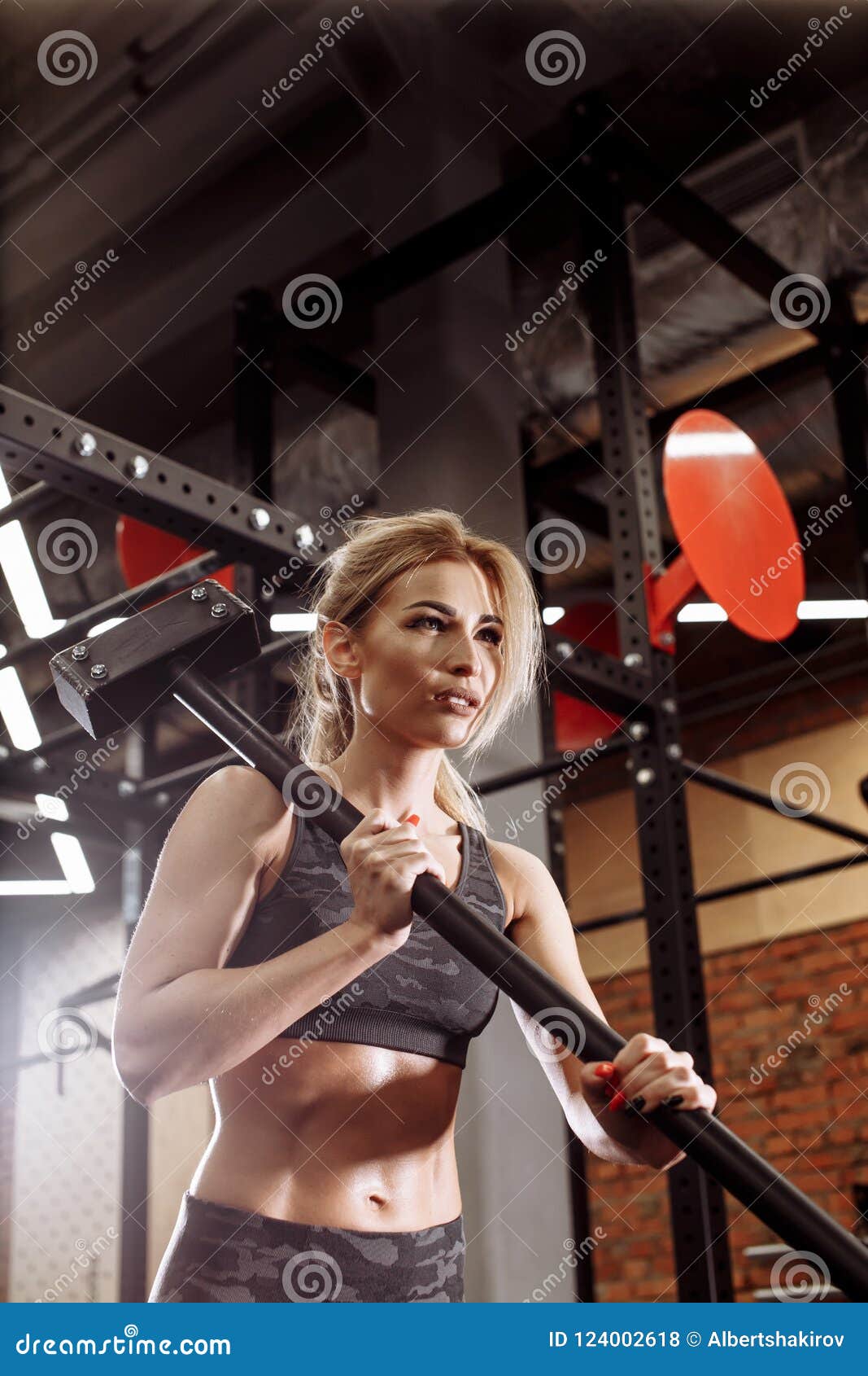 Gorgeous Woman is Using the Sledgehammer during Training Stock Photo ...