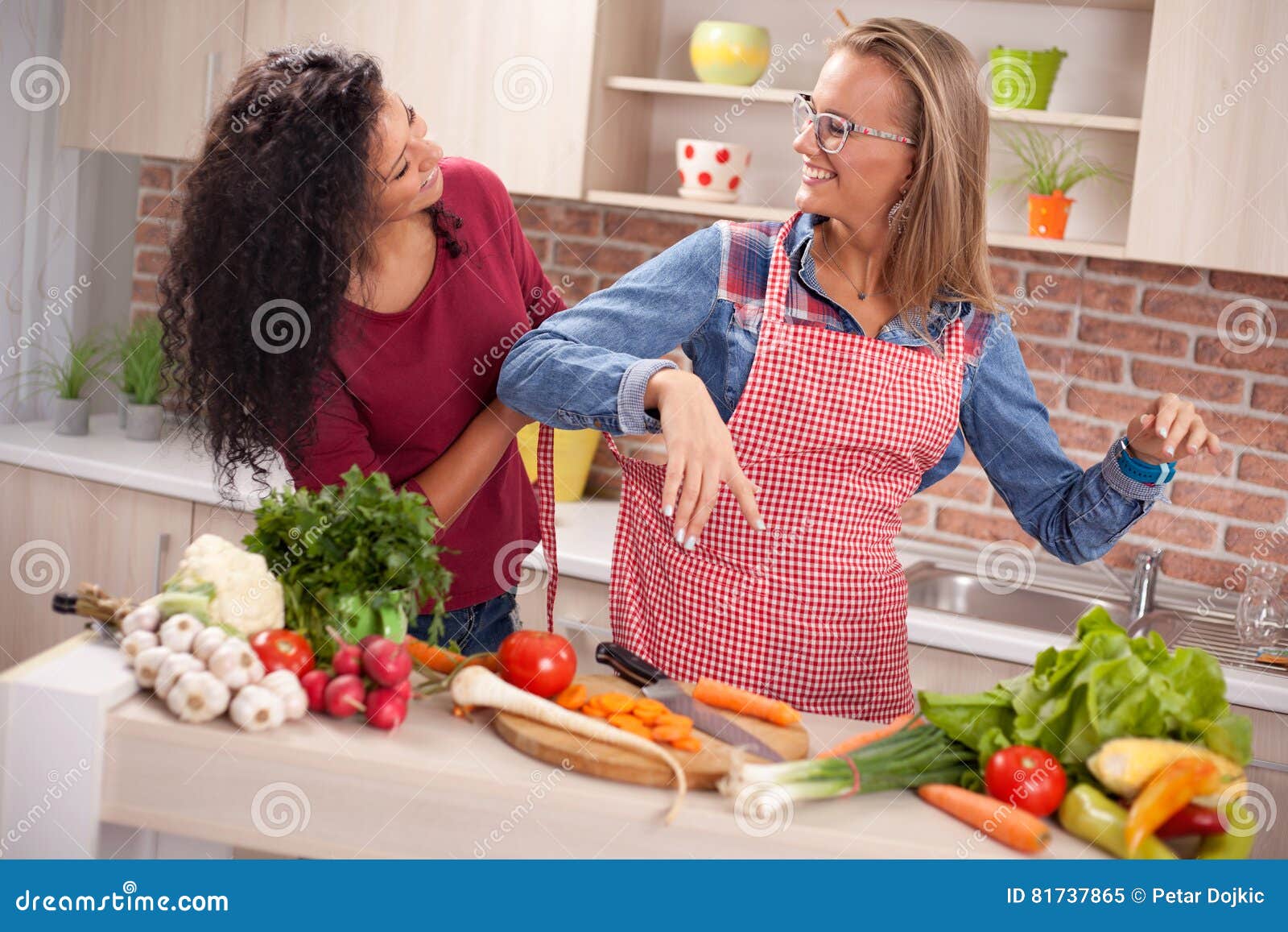 Gorgeous Young Women Preparing Dinner in a Kitchen Stock Image - Image ...