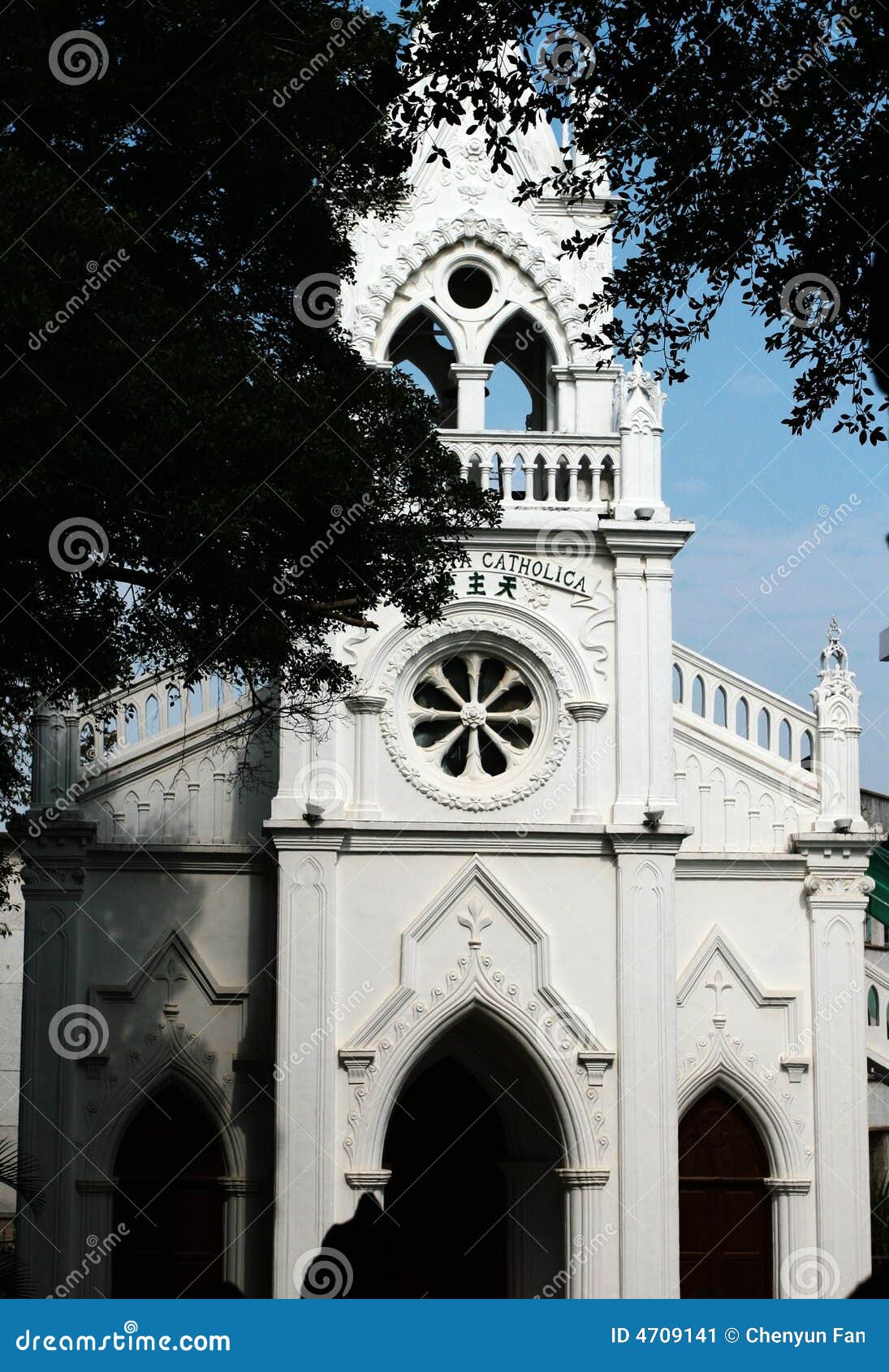 Gothic Church Spire Behind Silhouette Of Winter Tree Branches Stock ...