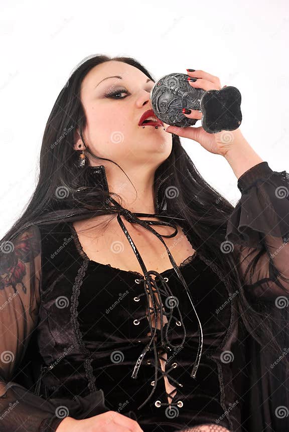 Gothic Girl Drinking from Goblet Stock Photo - Image of corset, goblet ...