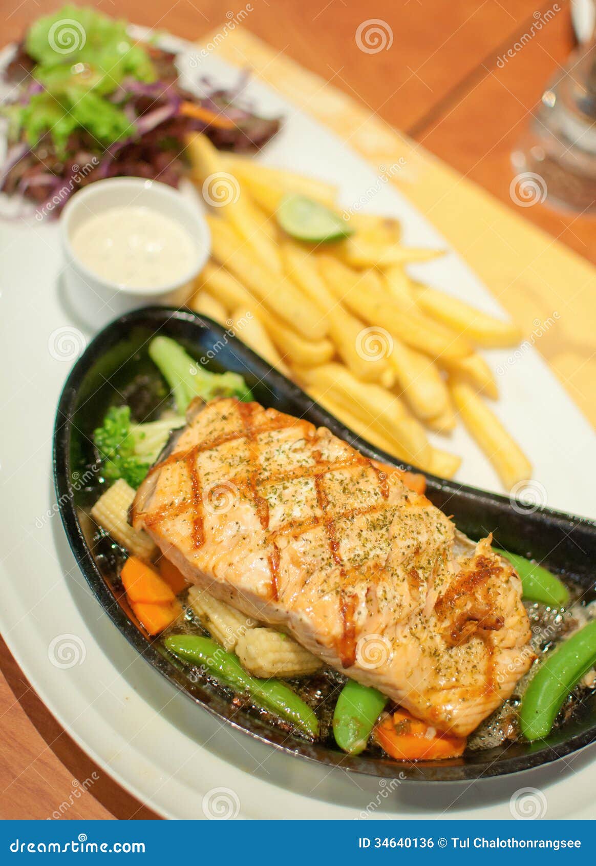 Gourmet Fish Dish With Spinach And Edible Flowers On Elegant Plate In ...