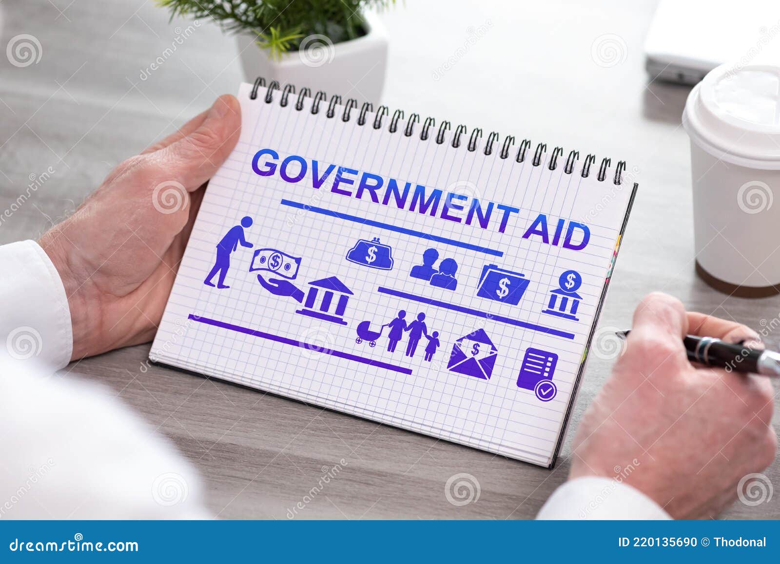Government Aid Concept on a Notepad Stock Photo - Image of hand ...