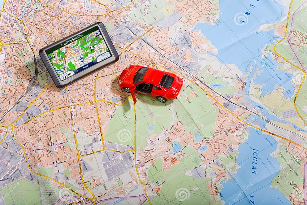 GPS Navigation System on a Traveling Map Stock Photo - Image of keys ...