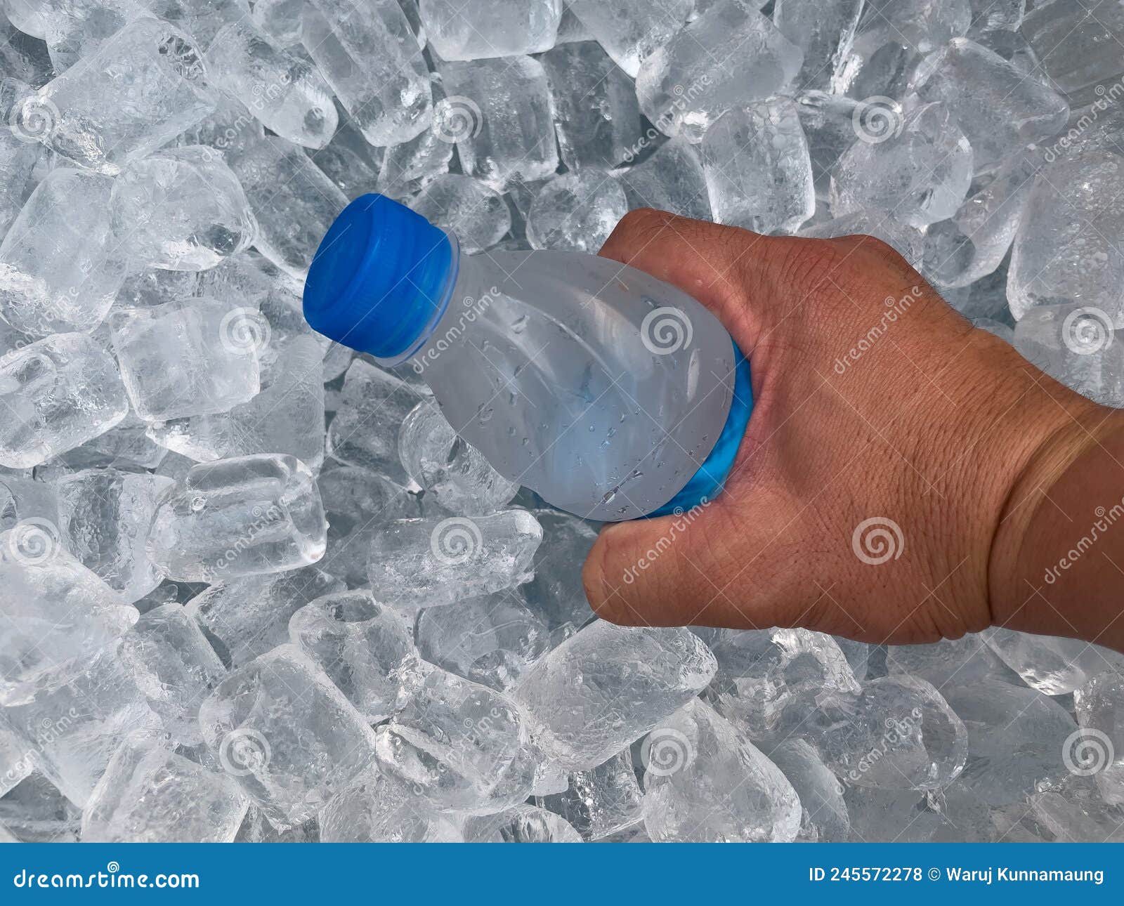 Grab a Bottle of Water from the Ice Pile. Stock Photo - Image of blue ...