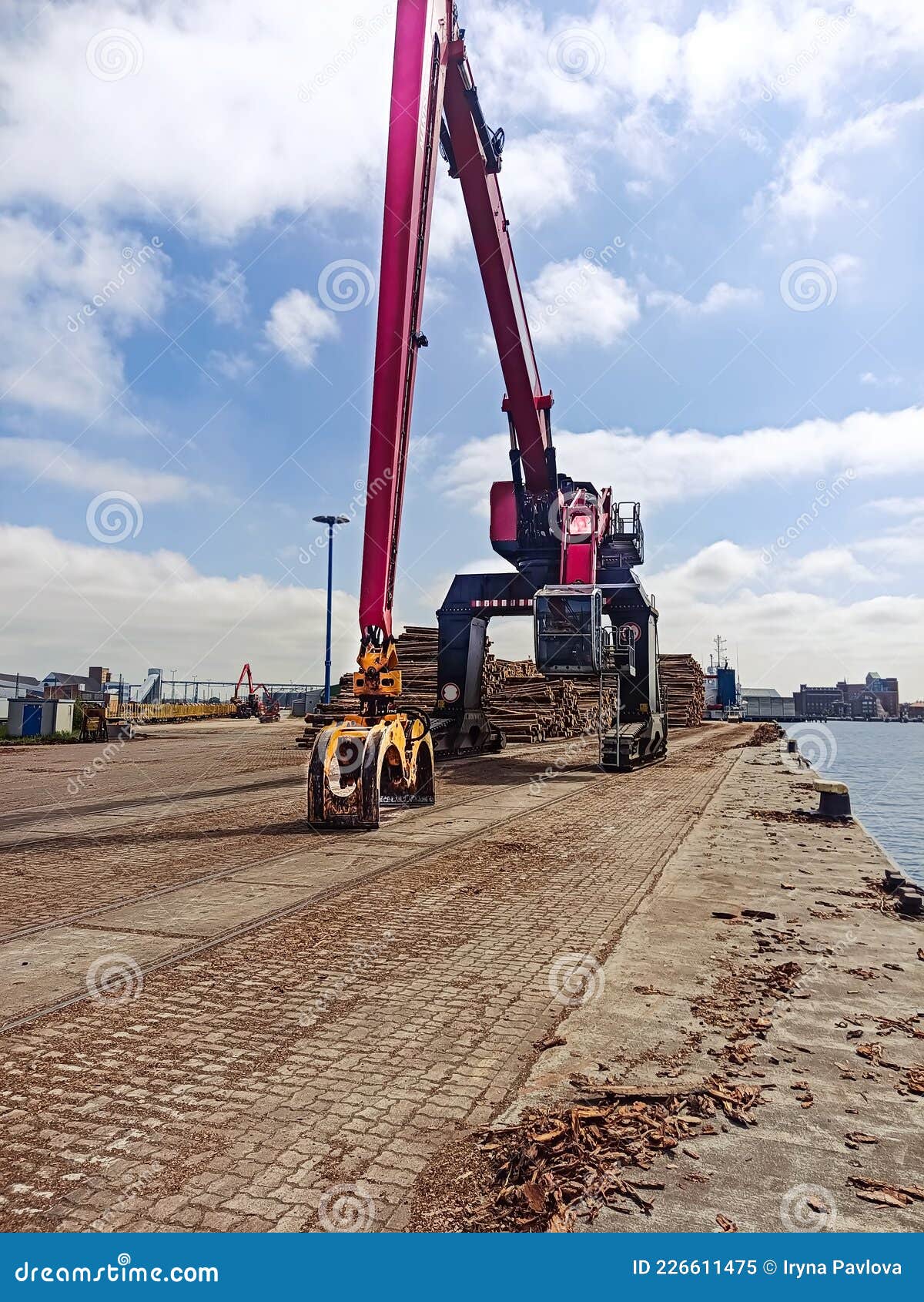 A Grab Bucket at the Berth for Loading Timber Onto Ships in the Port ...