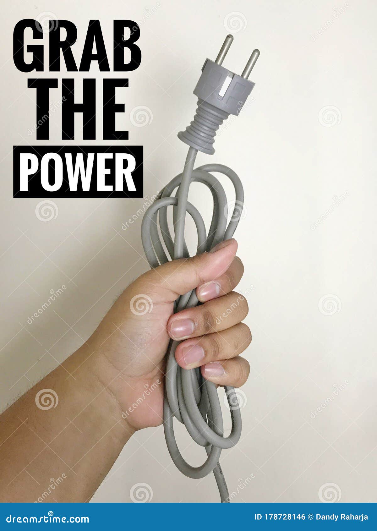 Grab the Power. a Quote of a Hand Holding a Cable Stock Photo - Image ...