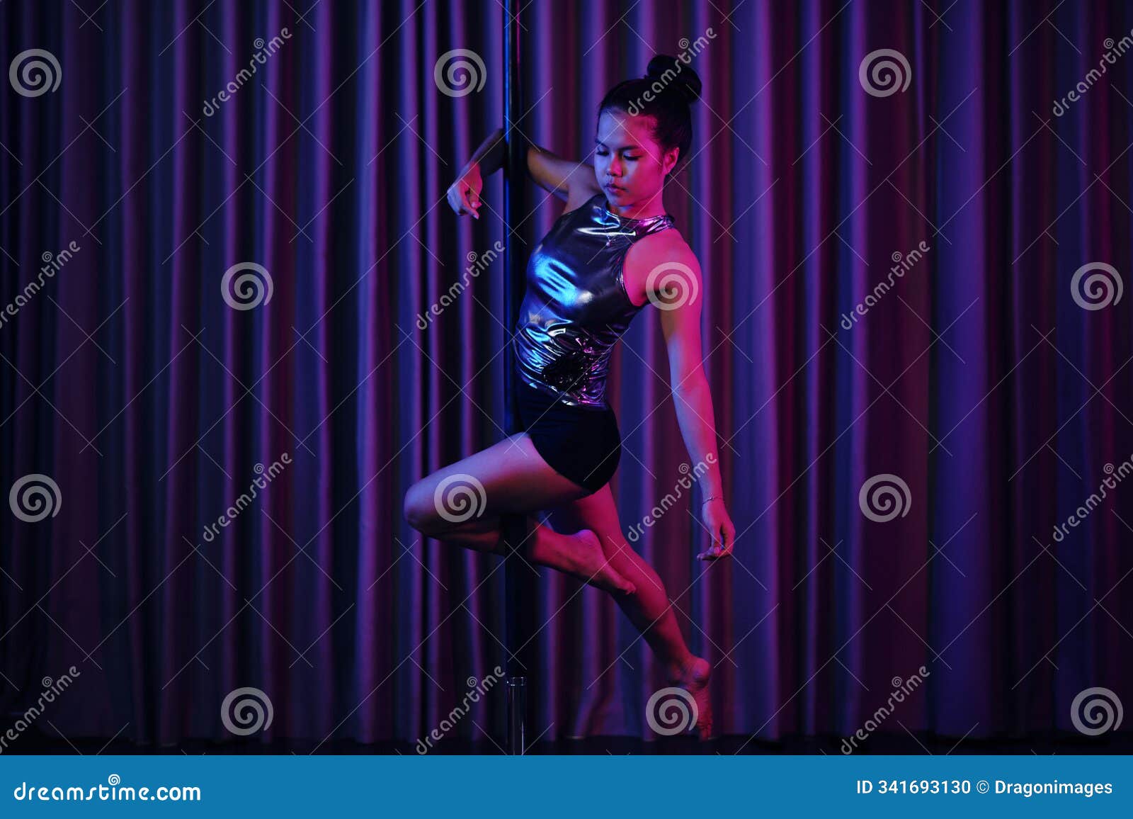 Graceful Performer Executing Pole Dance Routine Stock Photo - Image of ...
