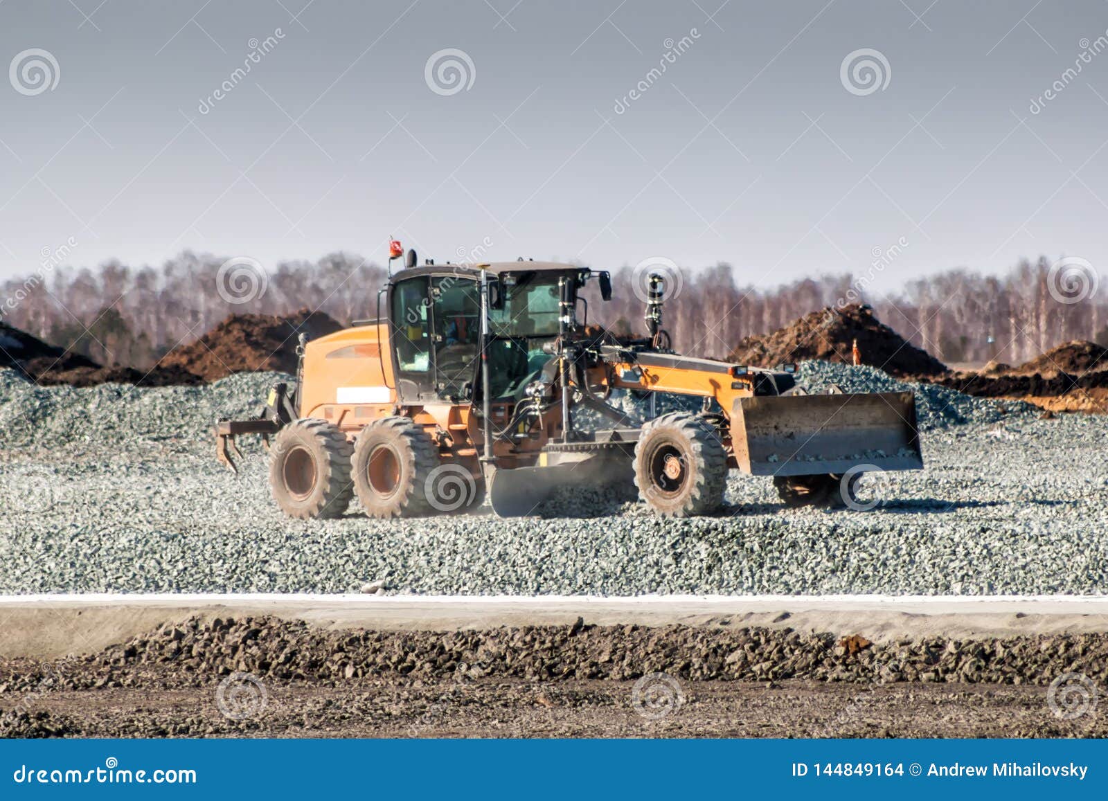 Grader Dredges Rubble on Road Construction Stock Photo - Image of ...