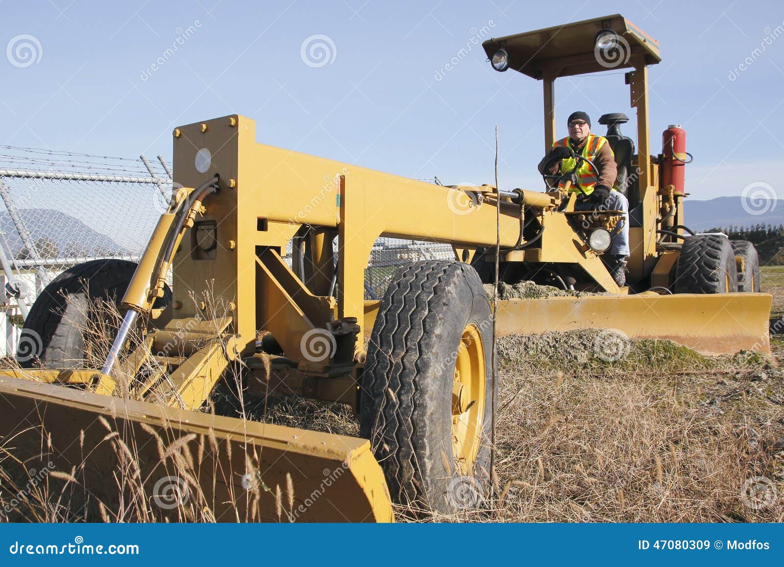 Grader and Operator stock image. Image of safety, construction - 47080309