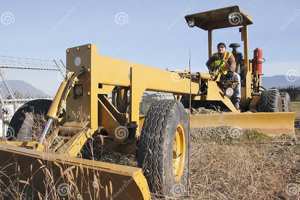 Grader and Operator stock image. Image of safety, construction - 47080309