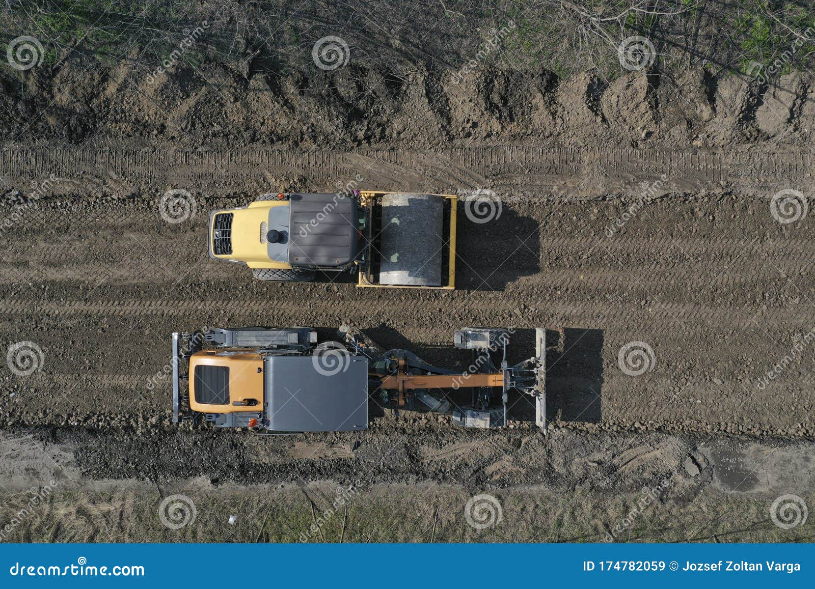 Grader Road Construction. a Motor Grader Works on a Site on a Road ...