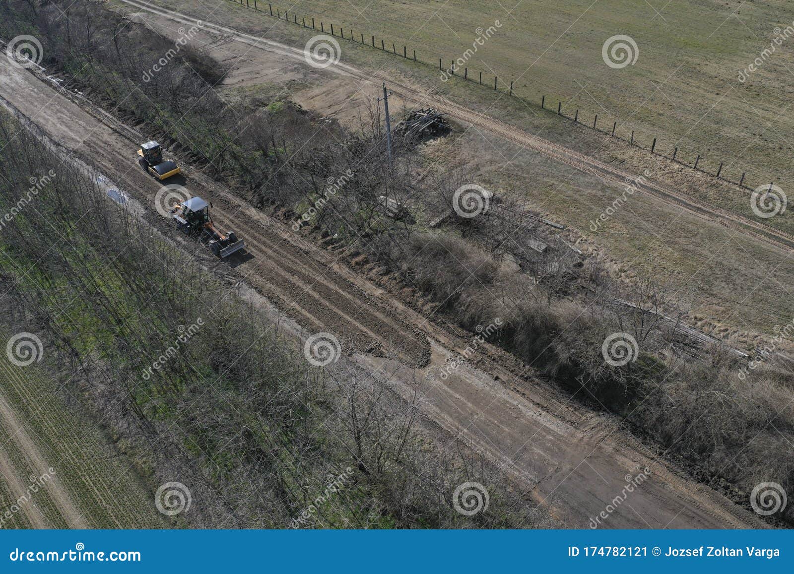 Grader Road Construction. a Motor Grader Works on a Site on a Road ...