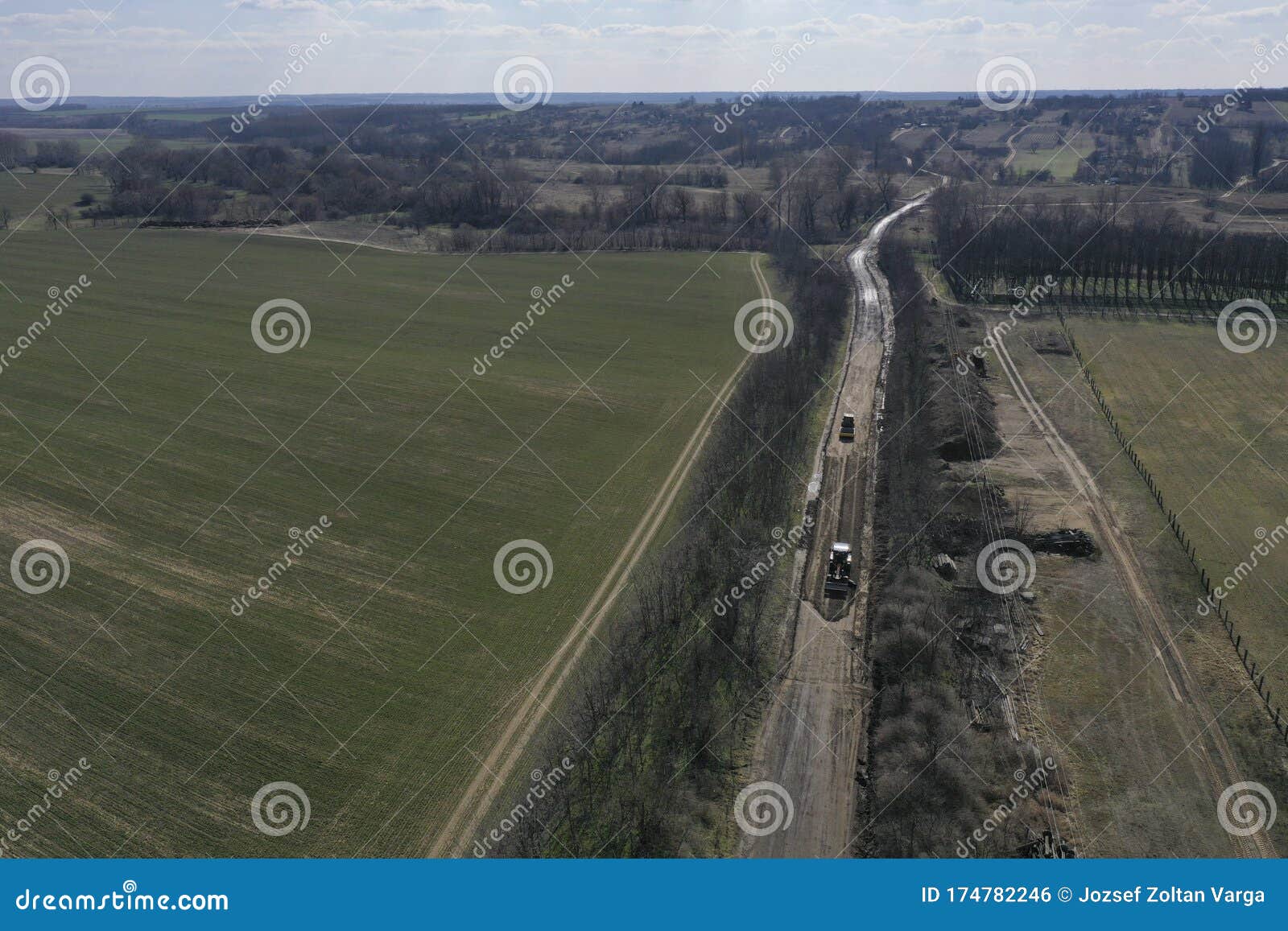 Grader Road Construction. a Motor Grader Works on a Site on a Road ...