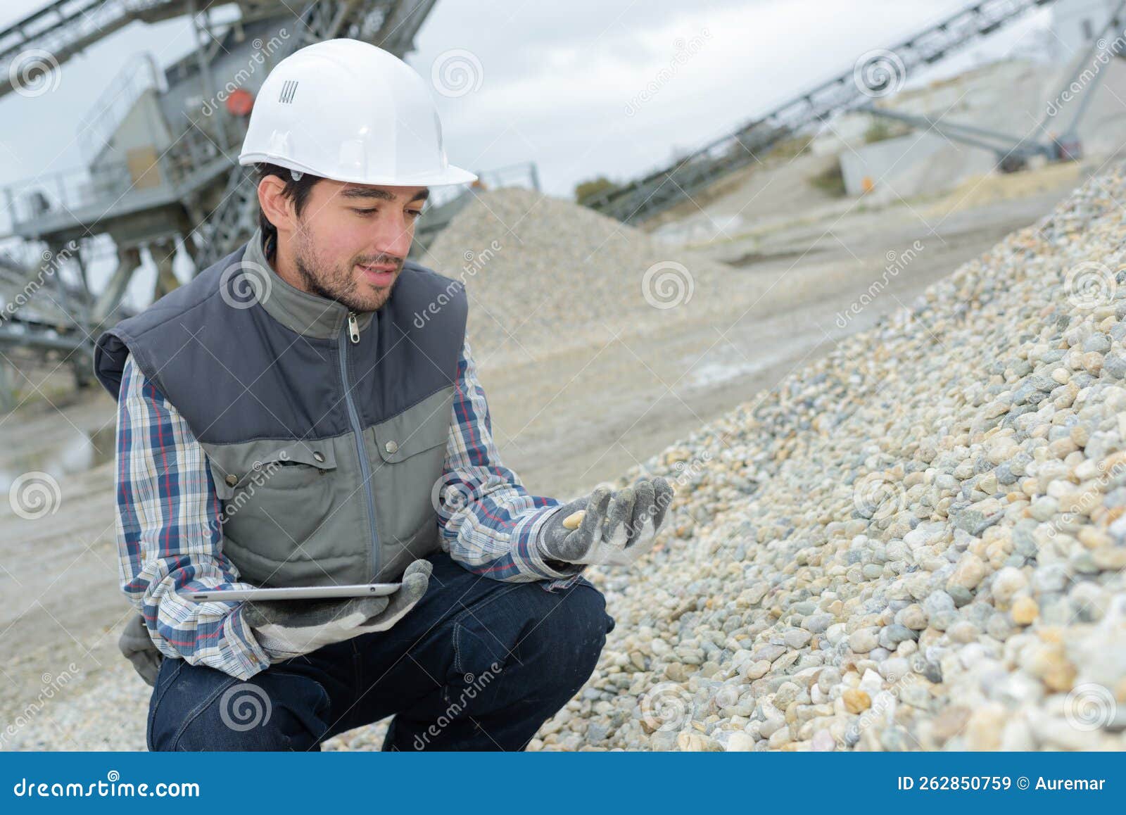 He grading pebbles stock image. Image of construction - 262850759