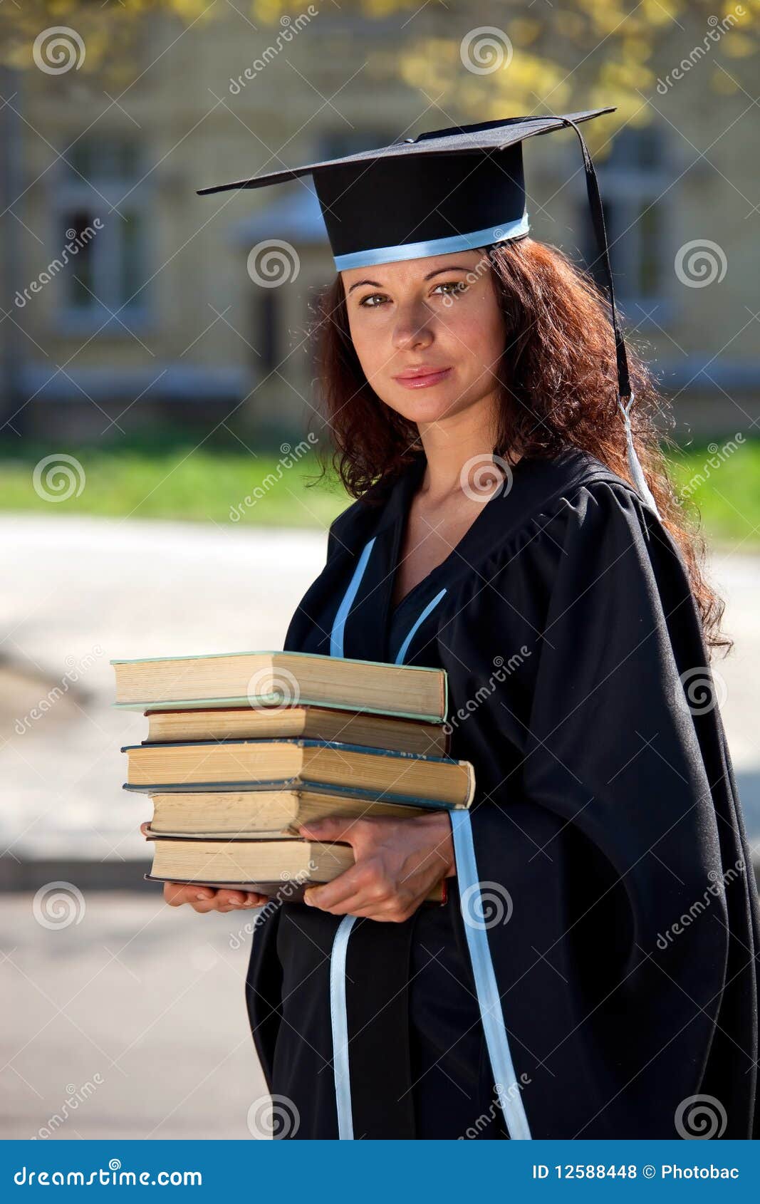 The graduate with books stock photo. Image of graduate - 12588448