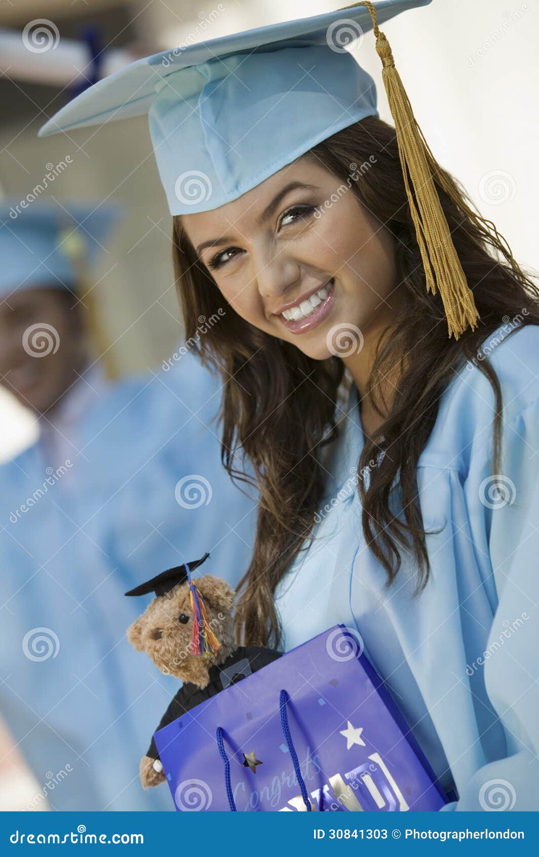 Graduate with Gift Bag Outside Portrait Stock Image - Image of curly ...
