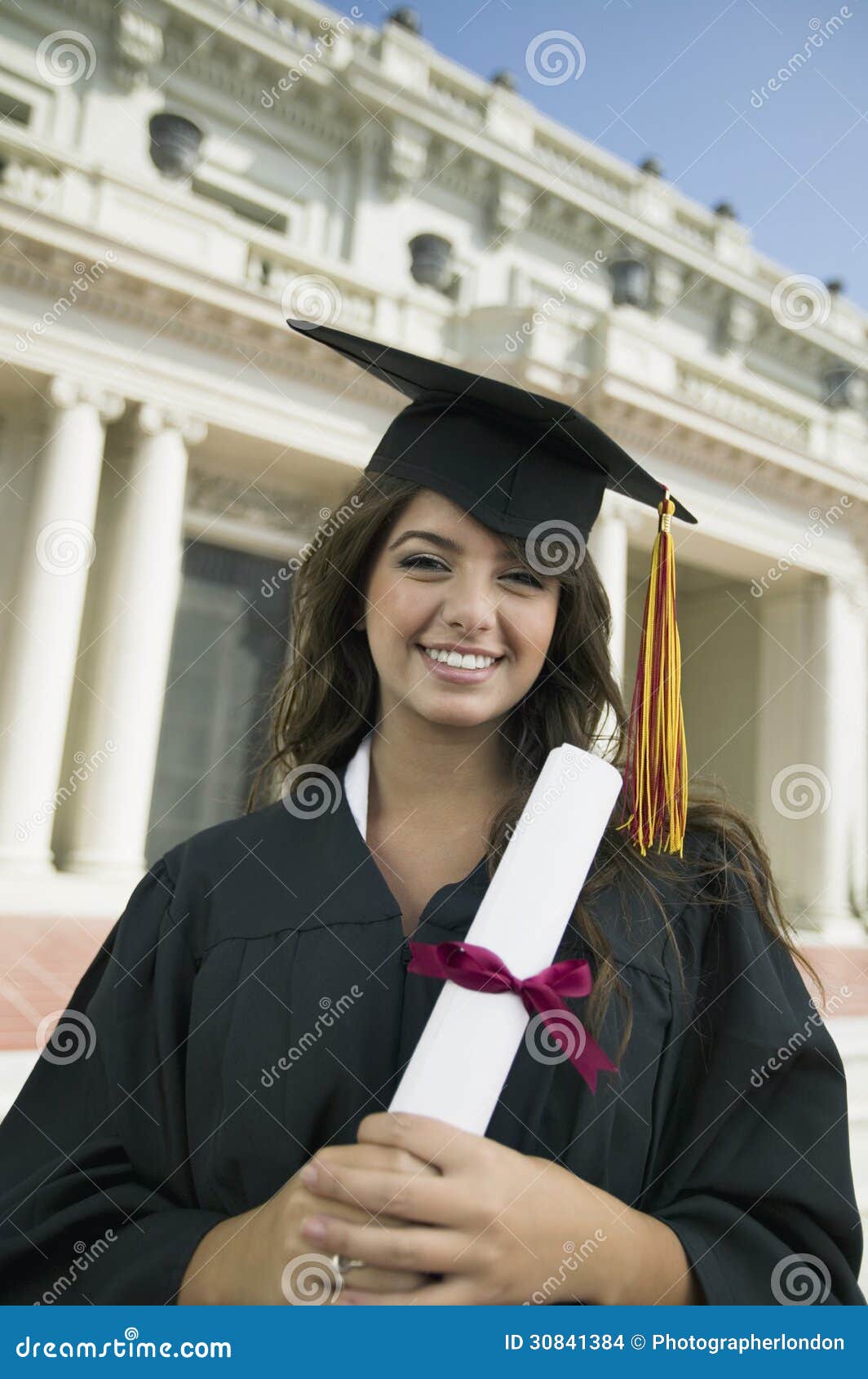 Graduate Holding Diploma Outside University Portrait Stock Photo ...