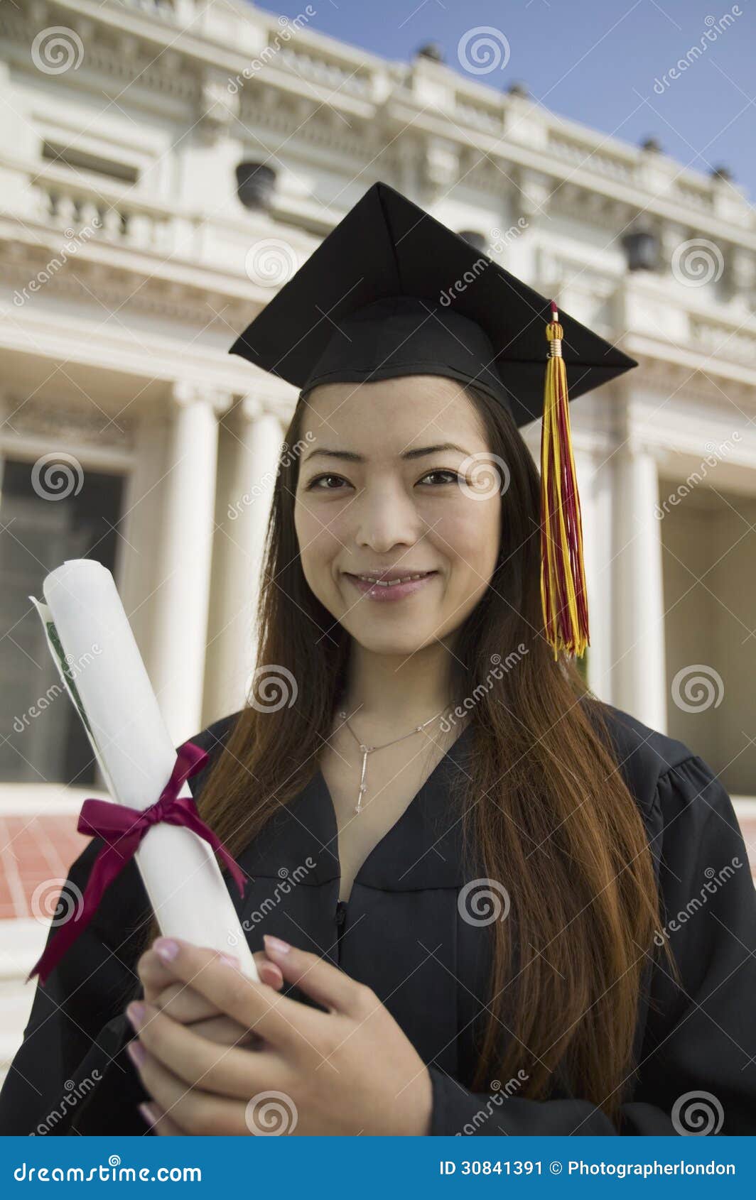 Graduate Holding Diploma Outside University Portrait Stock Image ...