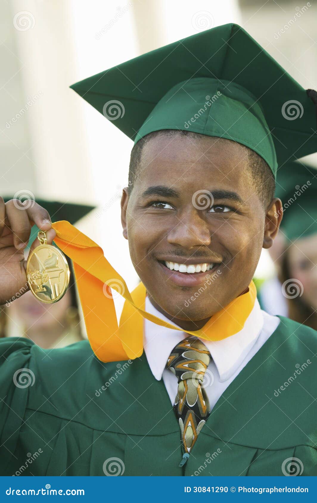 Graduate Holding Medal Outside Stock Photo - Image of gown, life: 30841290
