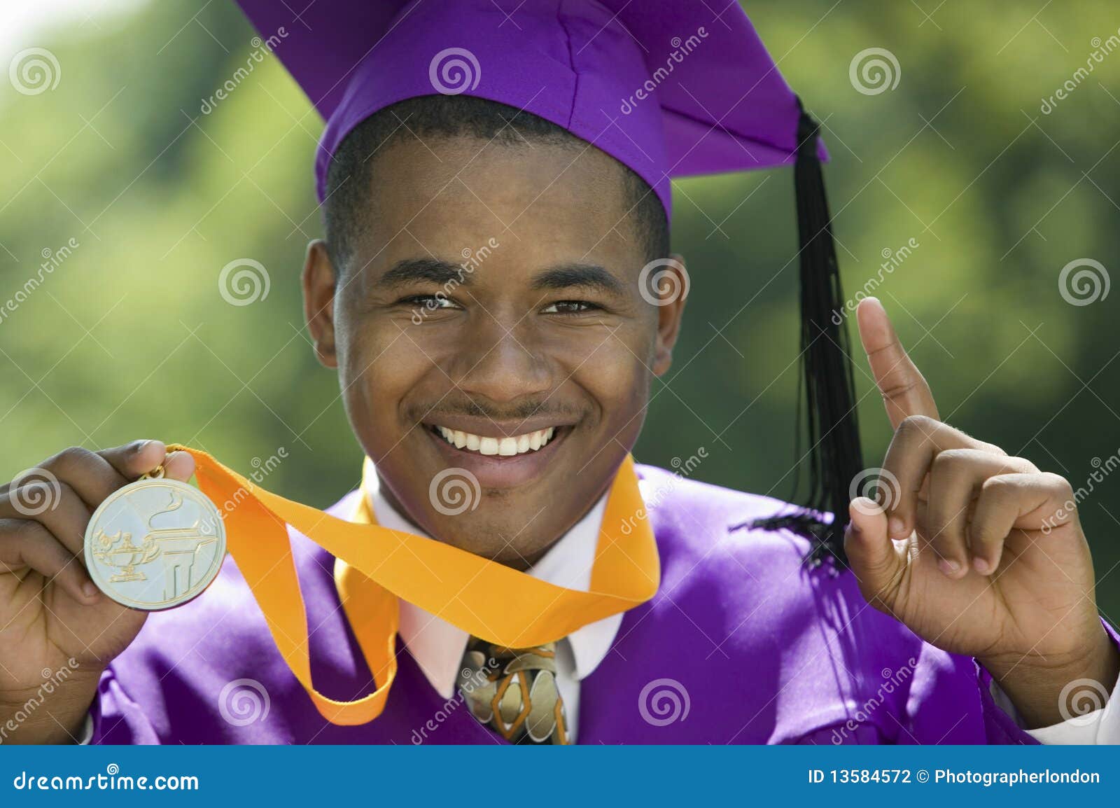 Graduate with Medal Holding One Finger Up Stock Photo - Image of life ...