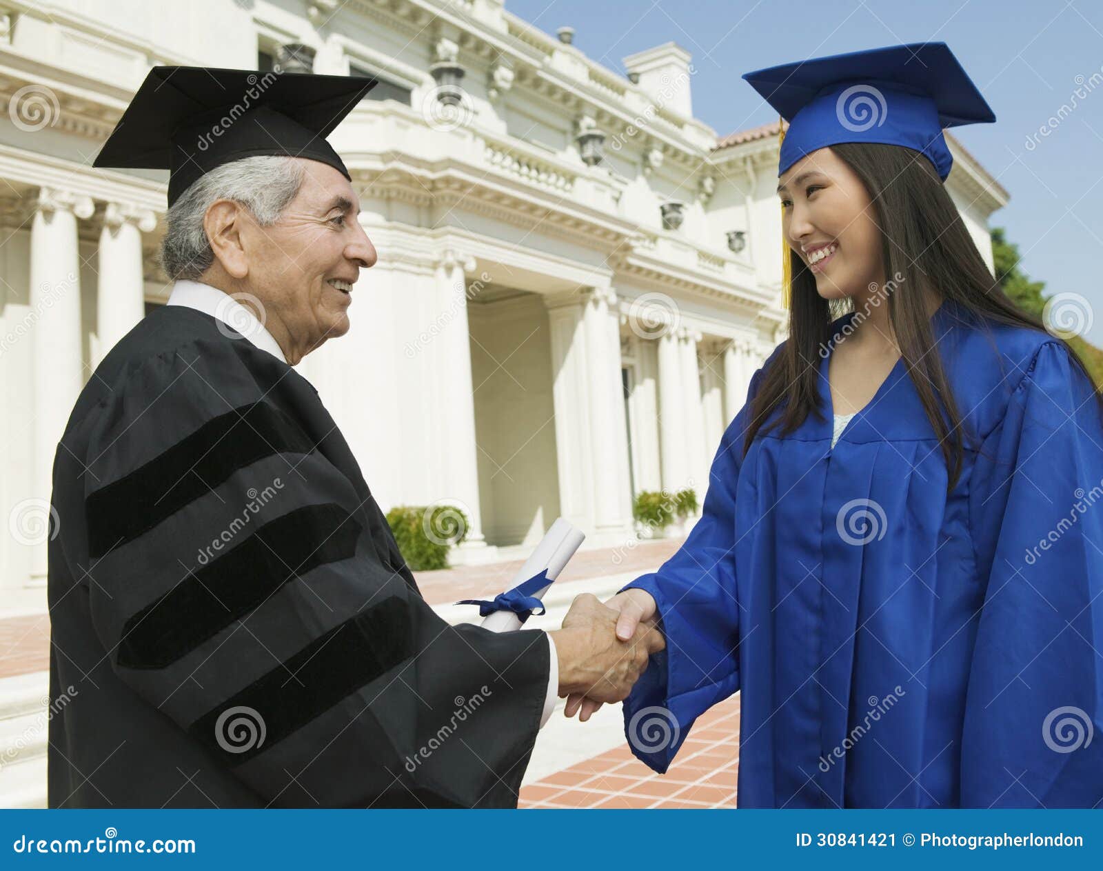 Graduate Shaking Hand of Dean Outside University Side View Stock Image ...