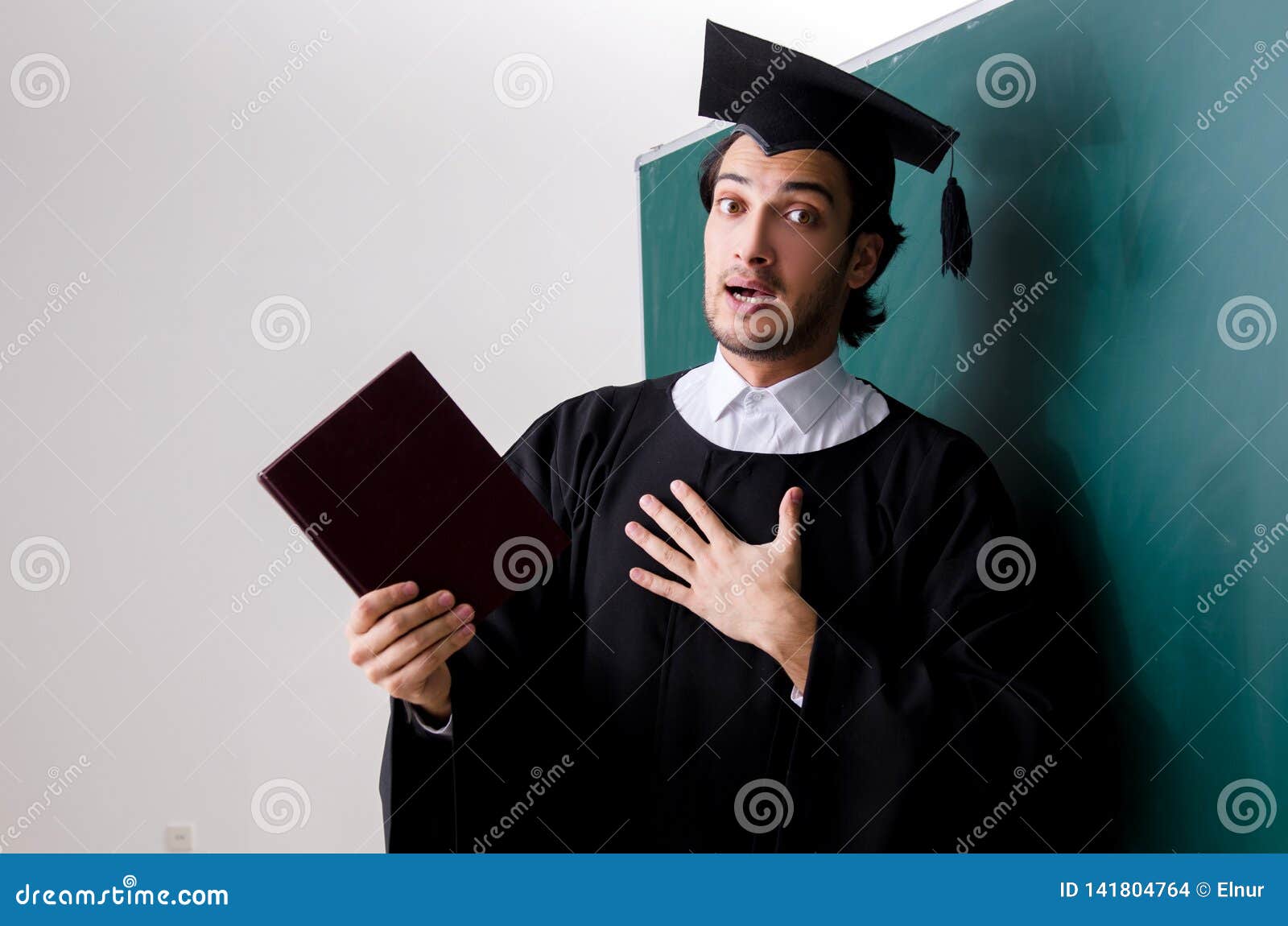 The Graduate Student in Front of Green Board Stock Photo - Image of ...