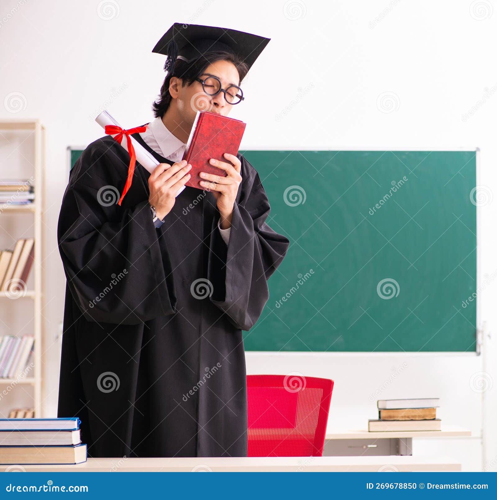 Graduate Student in Front of Green Board Stock Photo - Image of ...