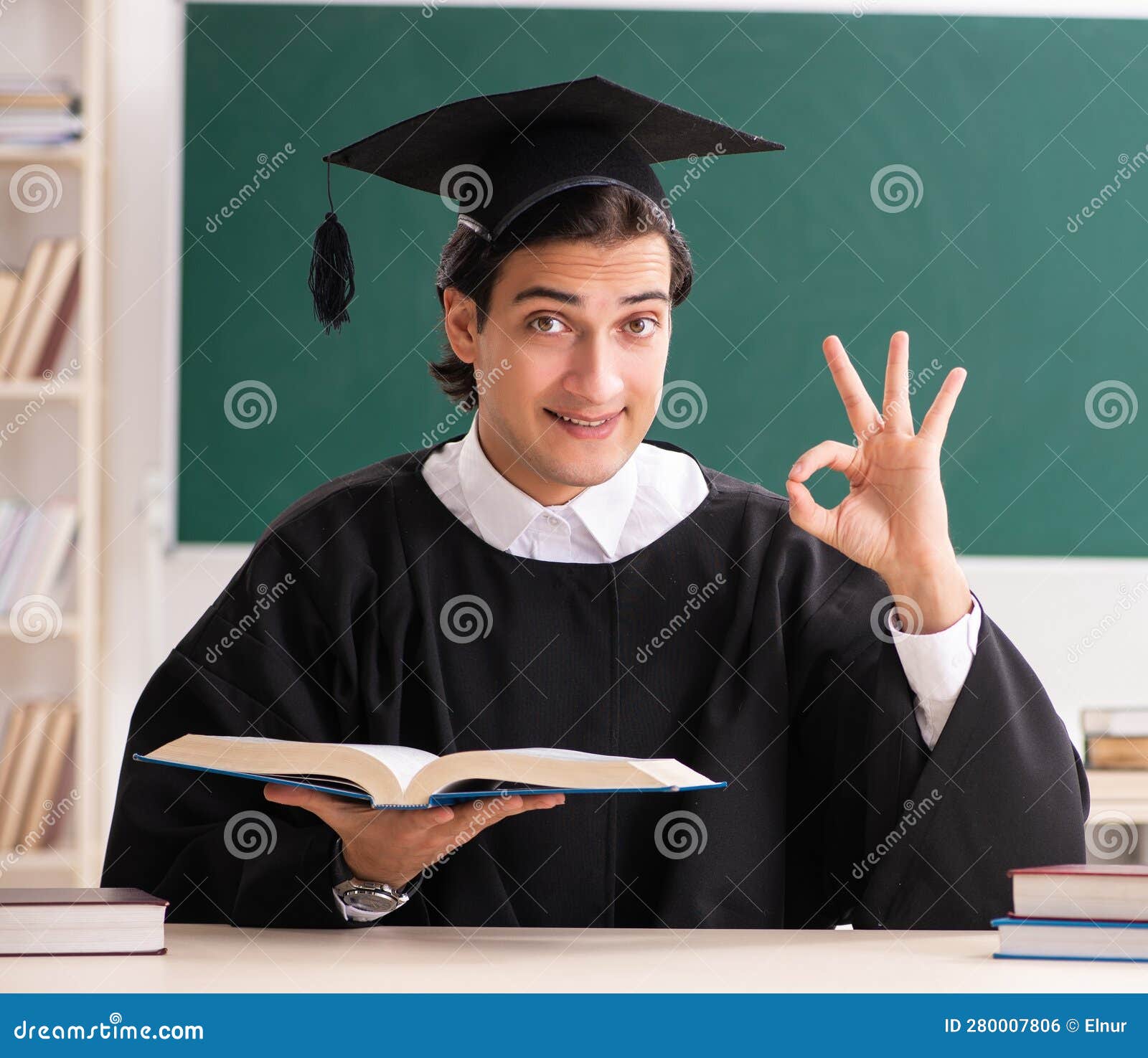 Graduate Student in Front of Green Board Stock Photo - Image of college ...
