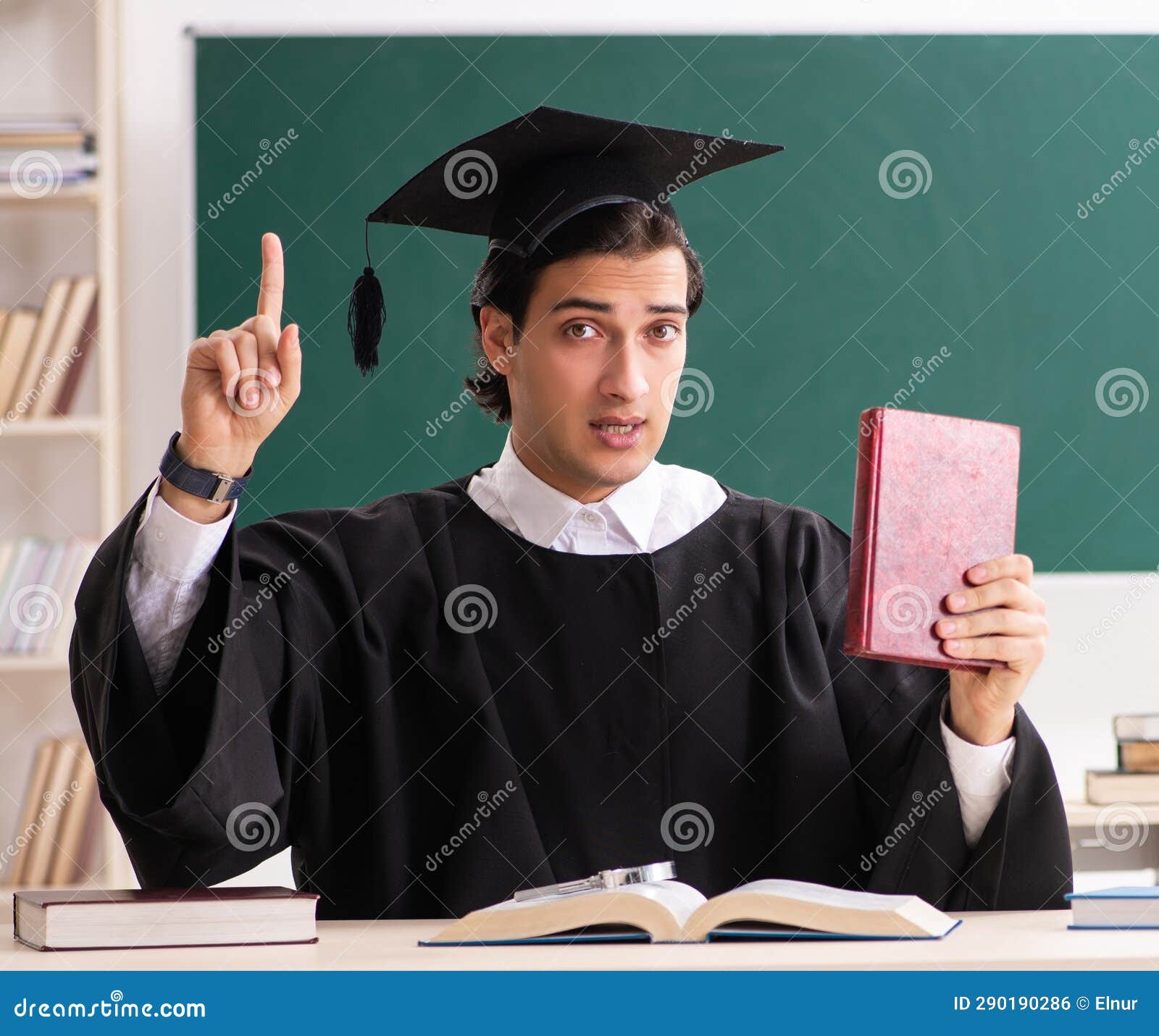 Graduate Student in Front of Green Board Stock Photo - Image of college ...