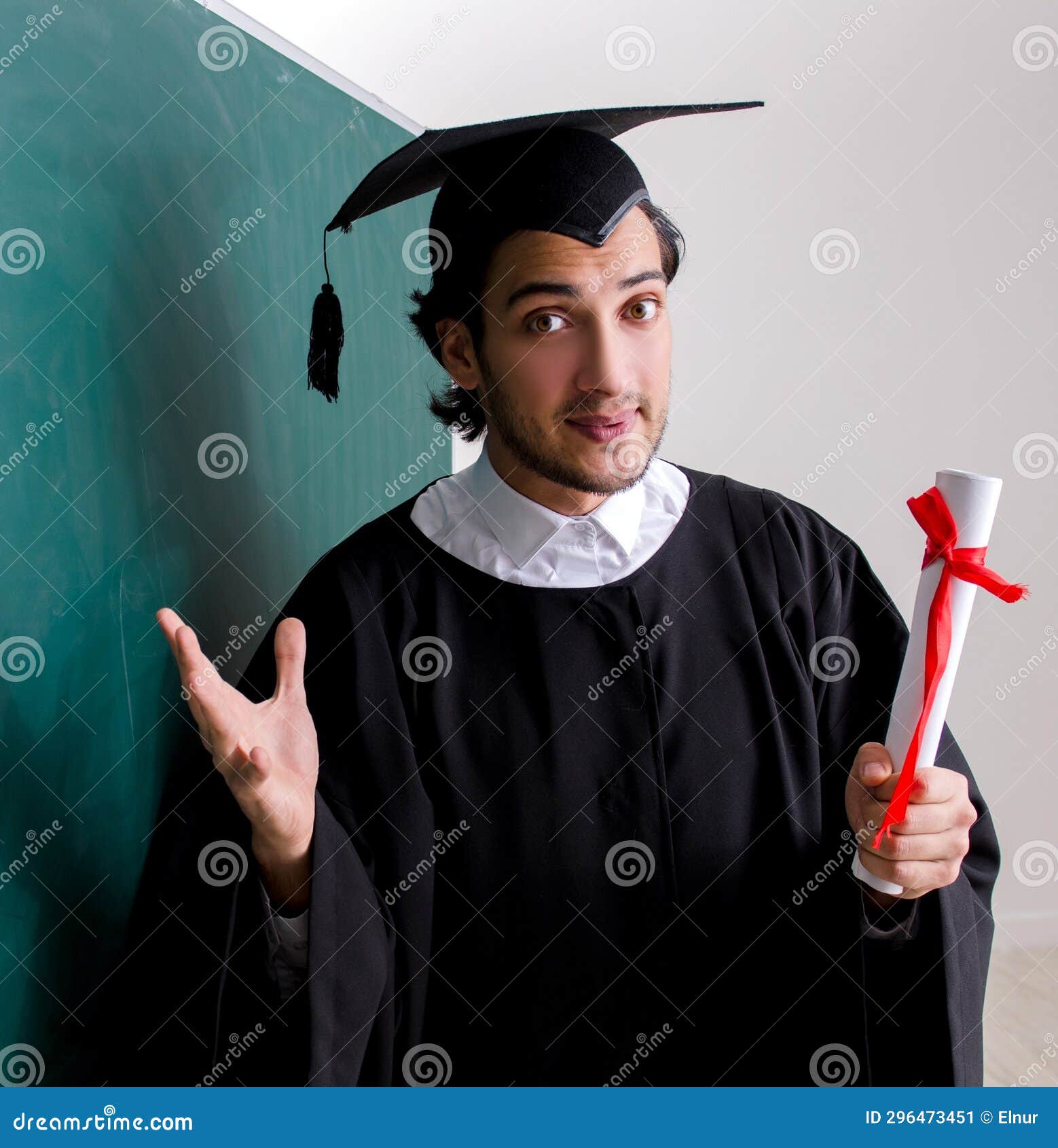 Graduate Student in Front of Green Board Stock Image - Image of degree ...