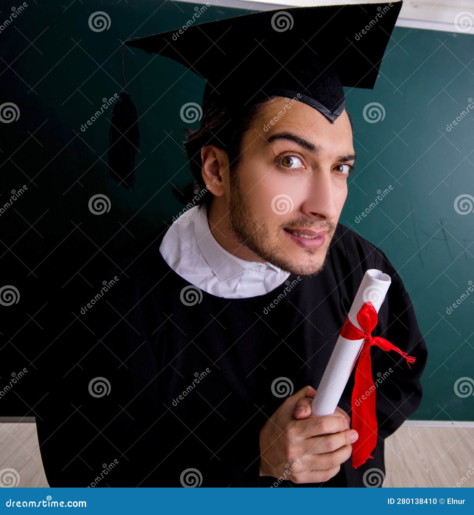 Graduate Student in Front of Green Board Stock Photo - Image of mortar ...