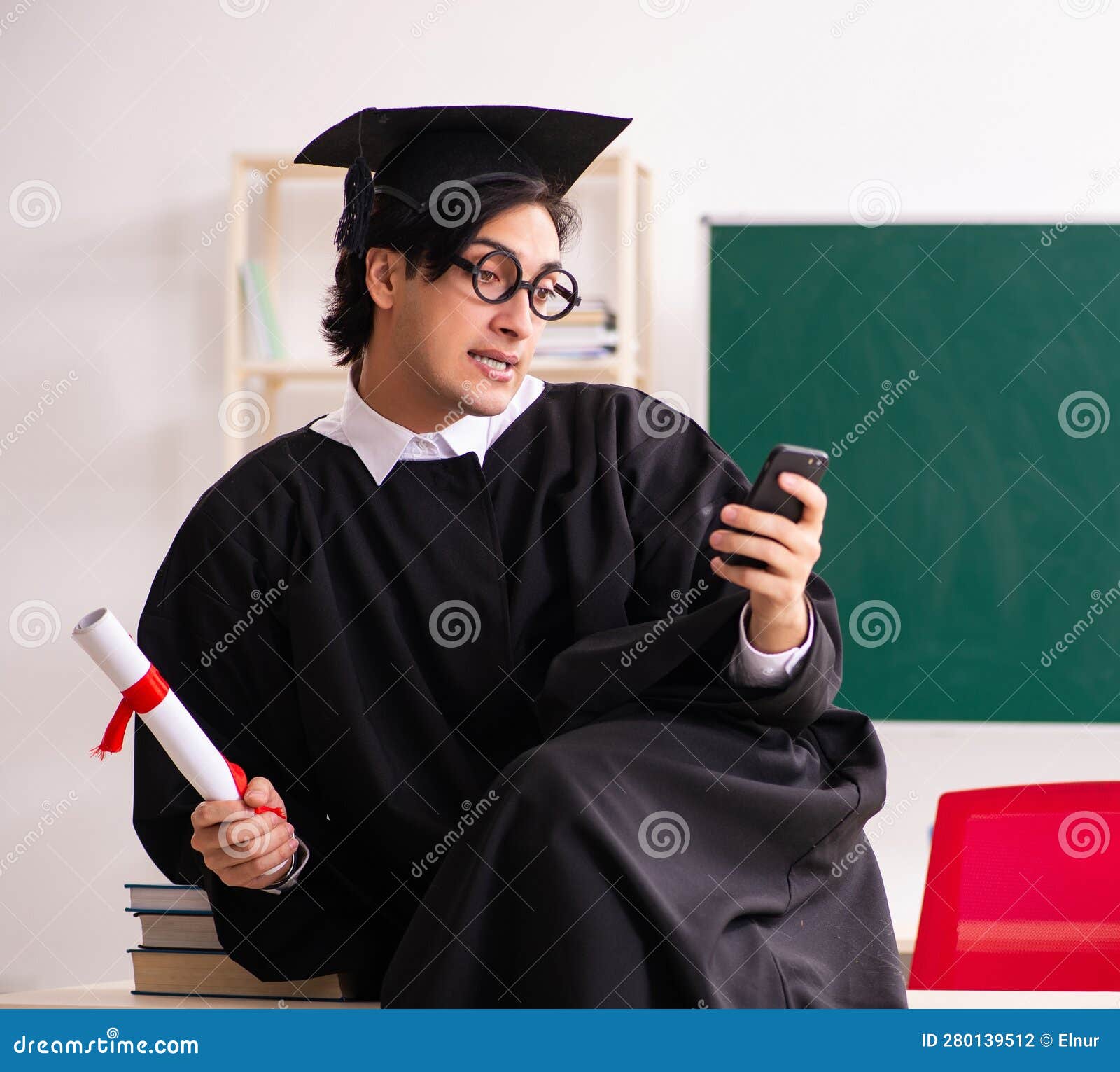Graduate Student in Front of Green Board Stock Photo - Image of master ...