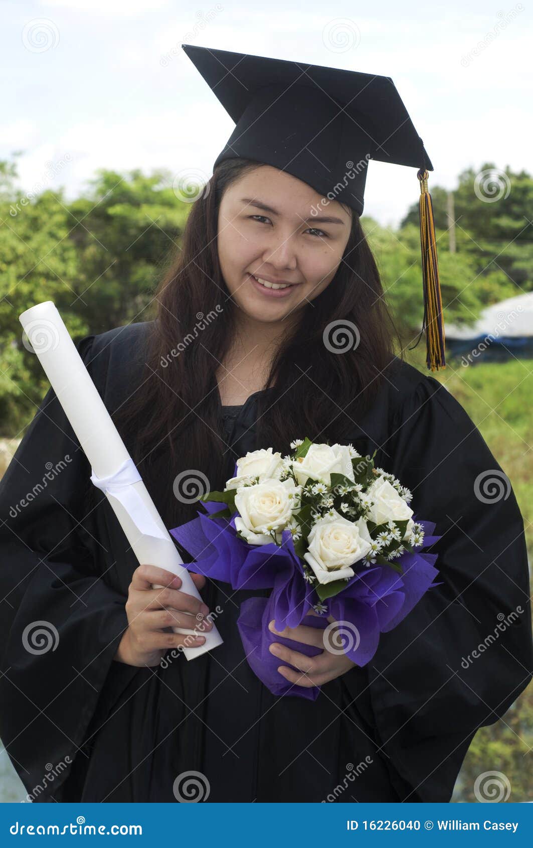 Graduate Student Holding Flowers and Diploma Stock Photo - Image of ...