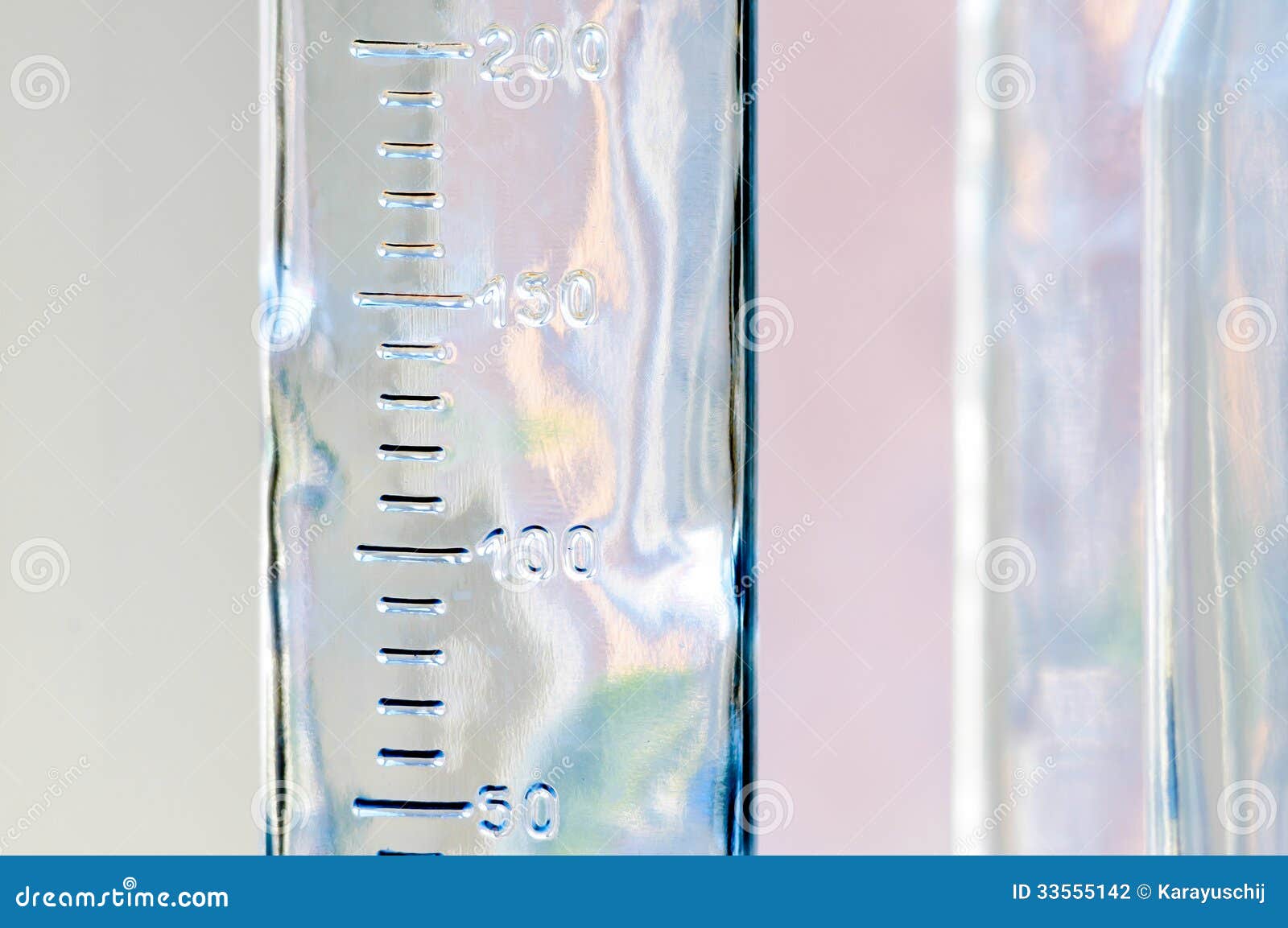 Graduated Glass Bottle stock photo. Image of quantity - 33555142