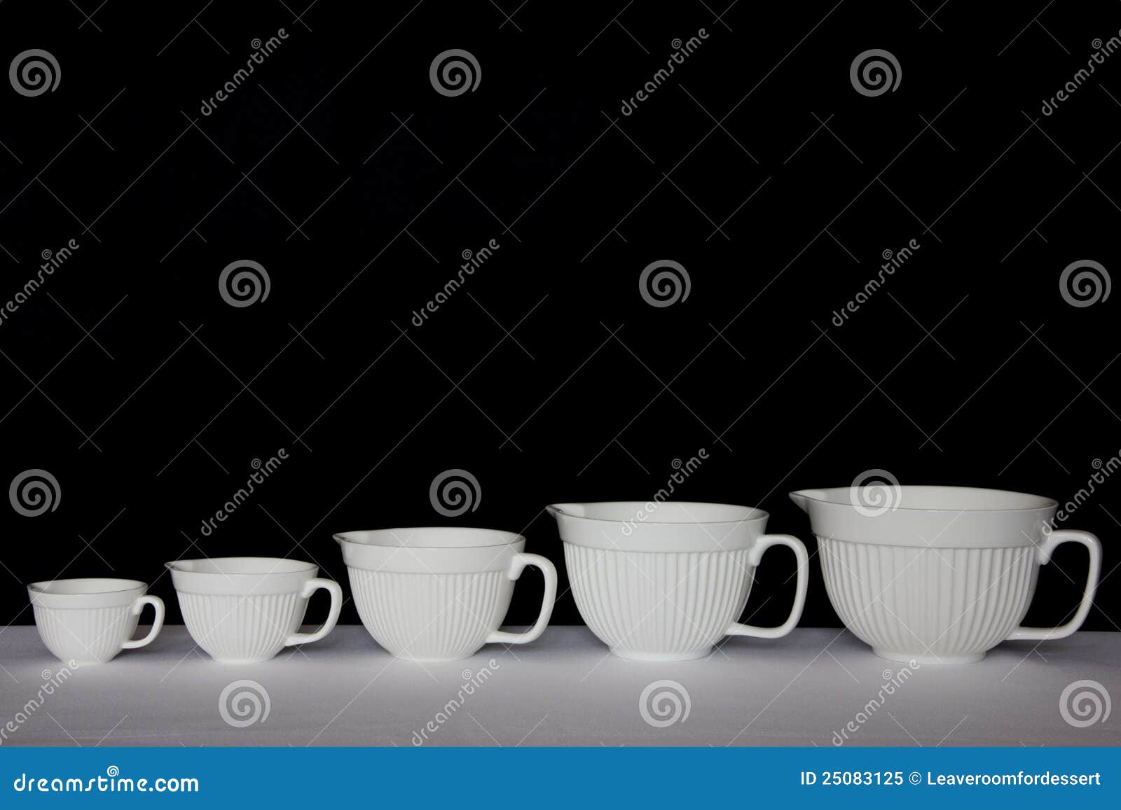 Graduated measuring cups stock image. Image of kitchen - 25083125