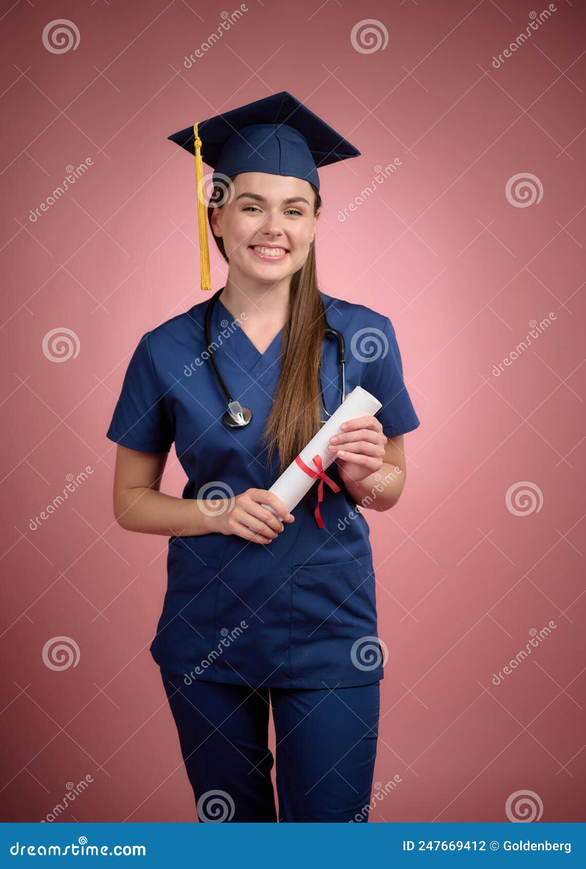 Graduated Nurse in Blue Uniform in Graduation Cap Standing and Holding ...