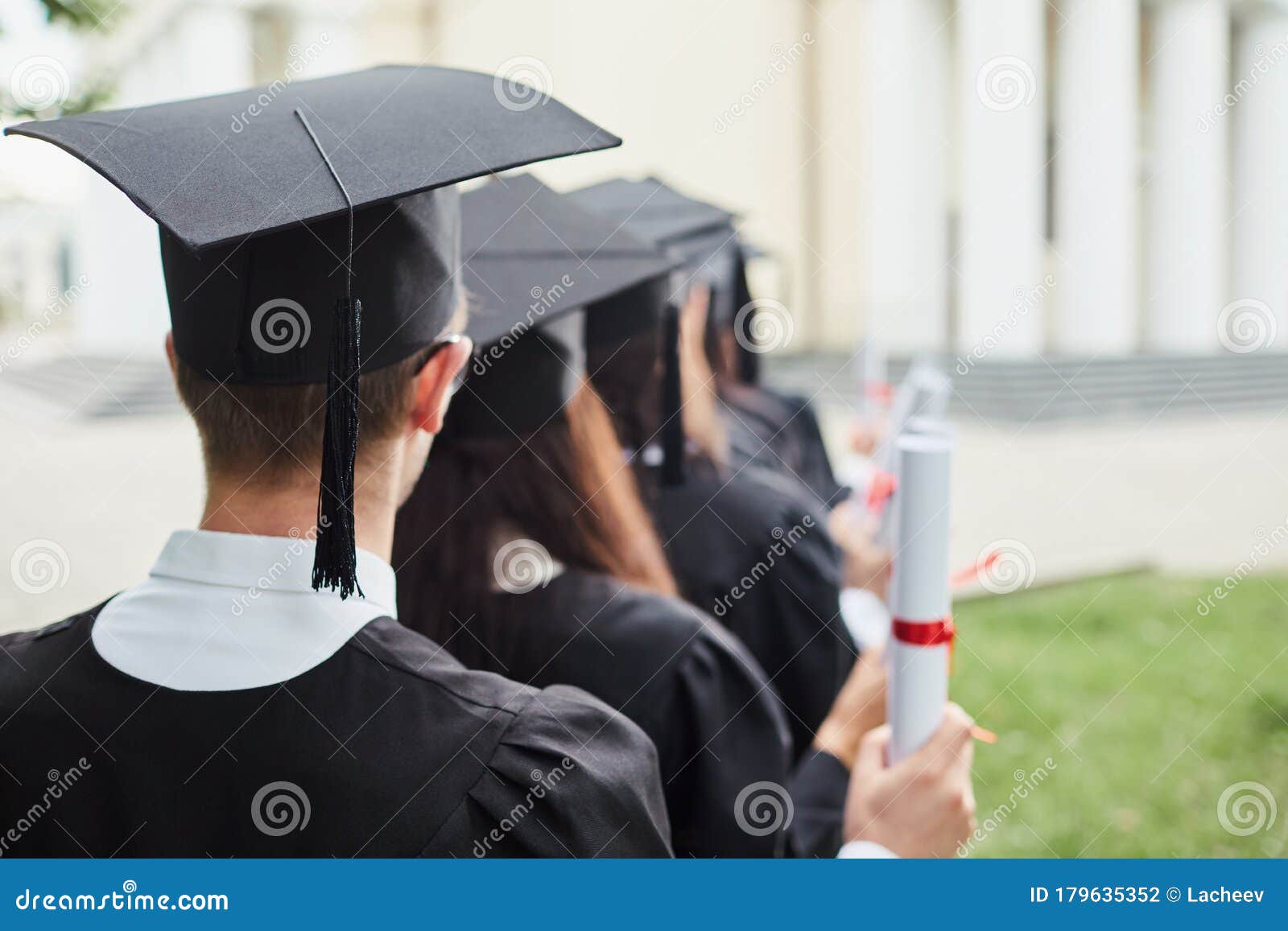 Graduates with Diplomas in Front of the University. Stock Photo - Image ...