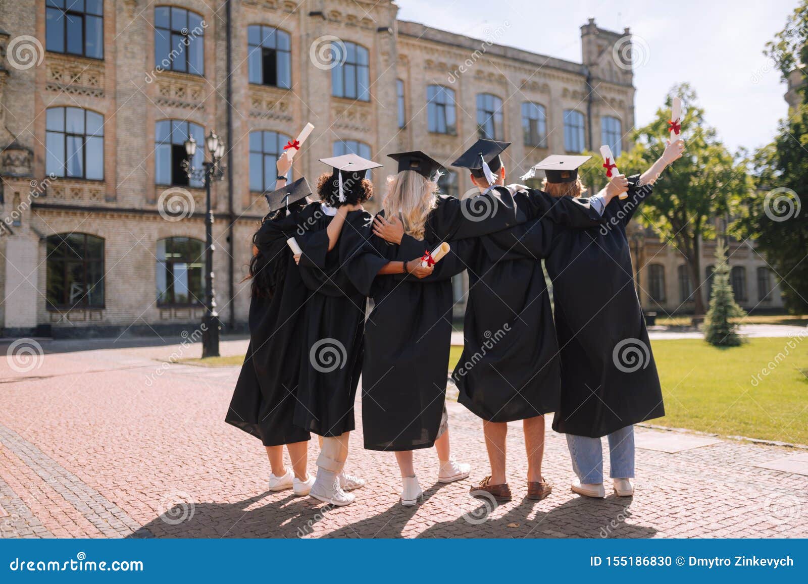 Graduates Looking at Their University for the Last Time. Stock Photo ...