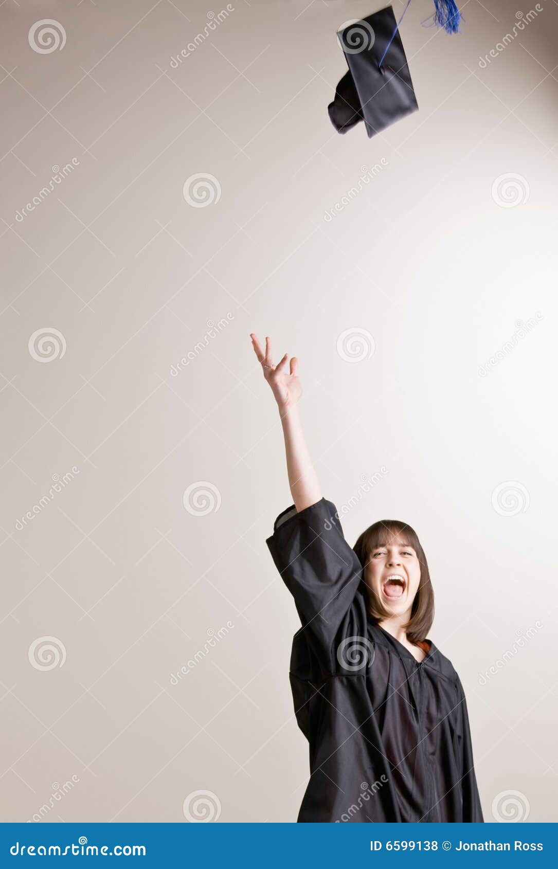 Graduating Student Throwing Cap in Air Stock Photo - Image of ...