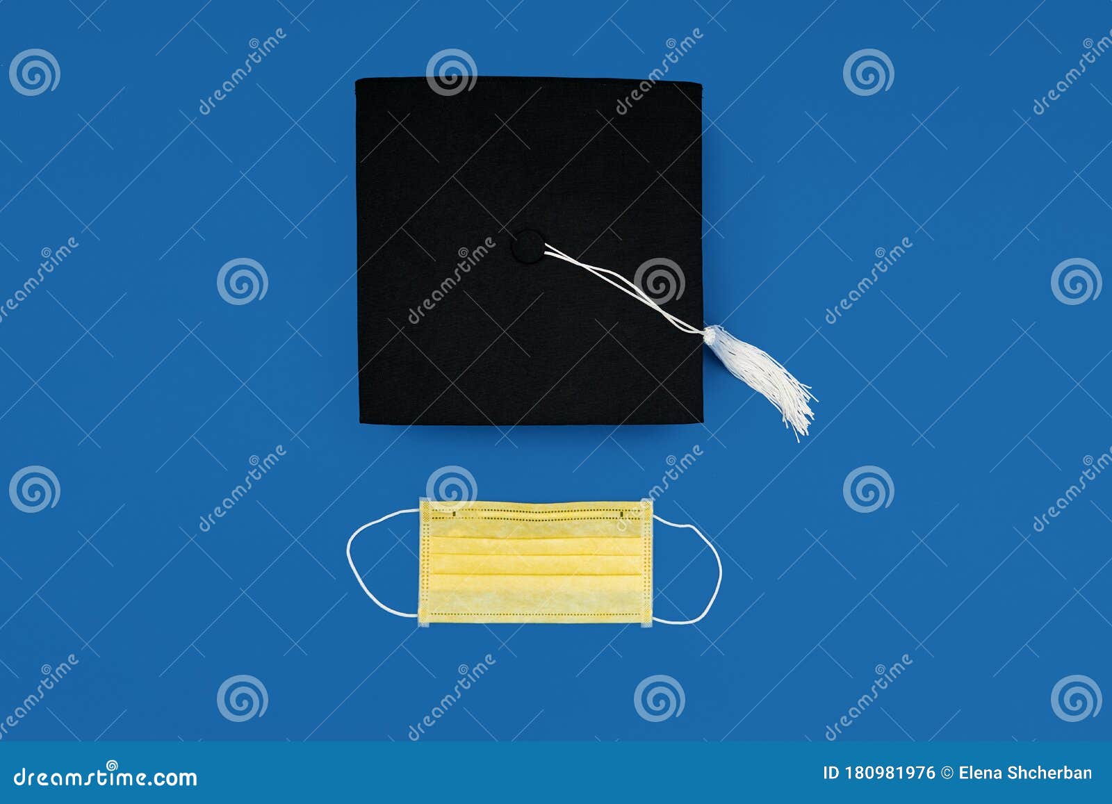 Graduation Cap and Face Shield on Blue Stock Photo - Image of ...