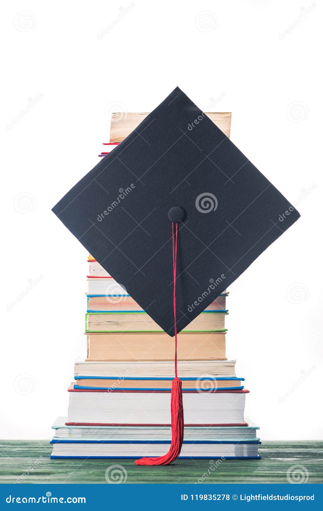 Graduation Cap in Front of Stacked Books Stock Photo - Image of ...