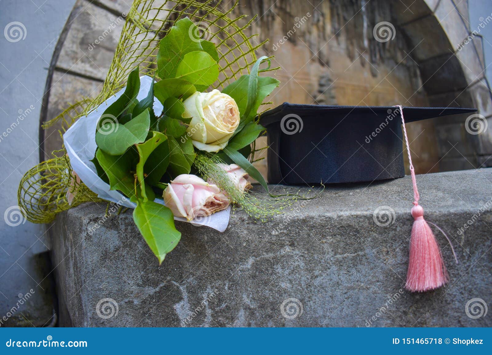 Graduation Cap or Mortaboard with a Bunch of Roses on the Old Stairs in ...