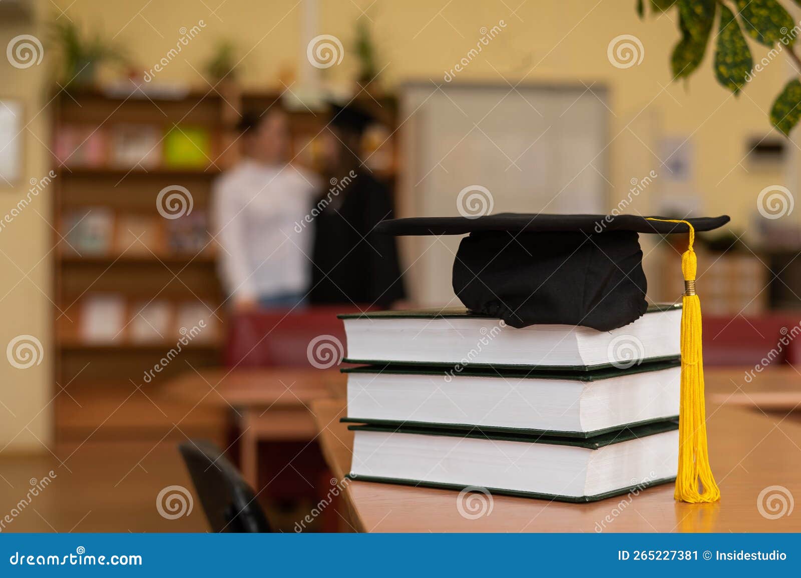 Graduation Cap on a Stack of Books in the Library. Stock Image - Image ...